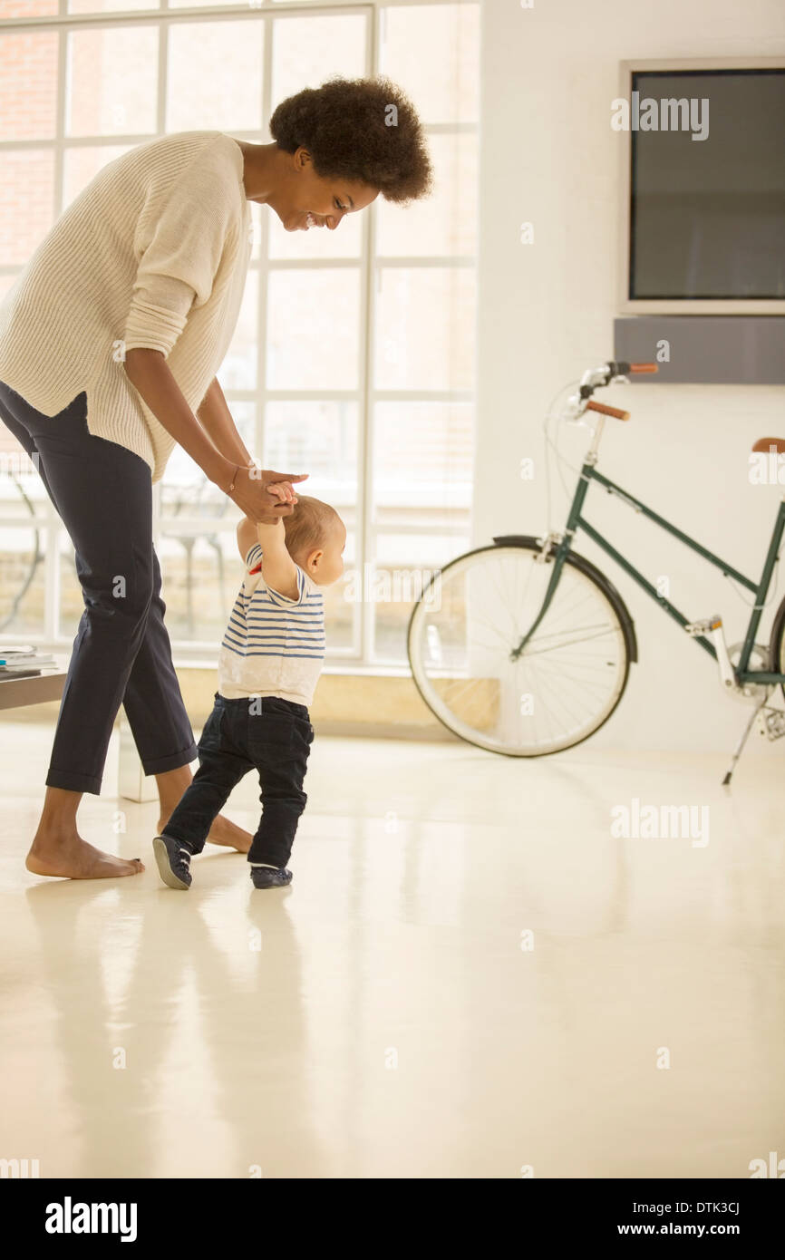 Helping mama hi-res stock photography and images - Alamy