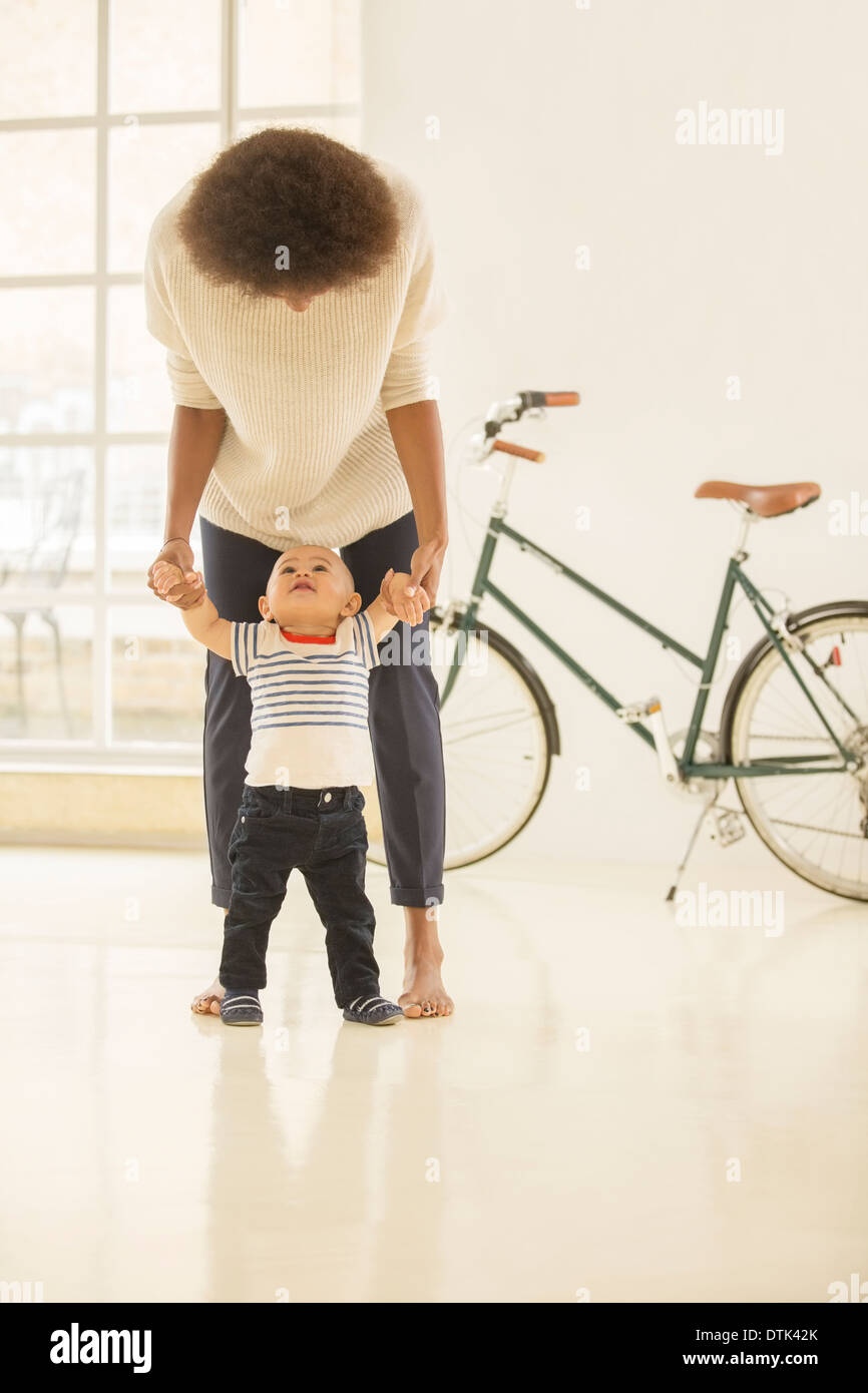 Helping mama hi-res stock photography and images - Alamy