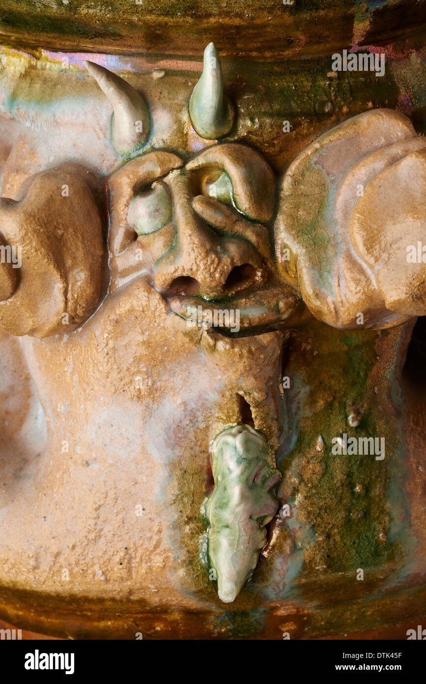 Gargoyle on pottery cup Stock Photo - Alamy