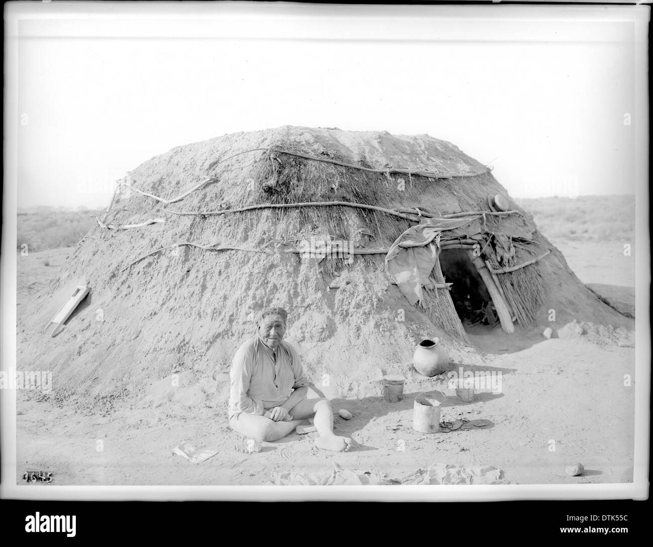 A portrait of a Pima Indian man named Ho-Dutch, sitting in front of his ...