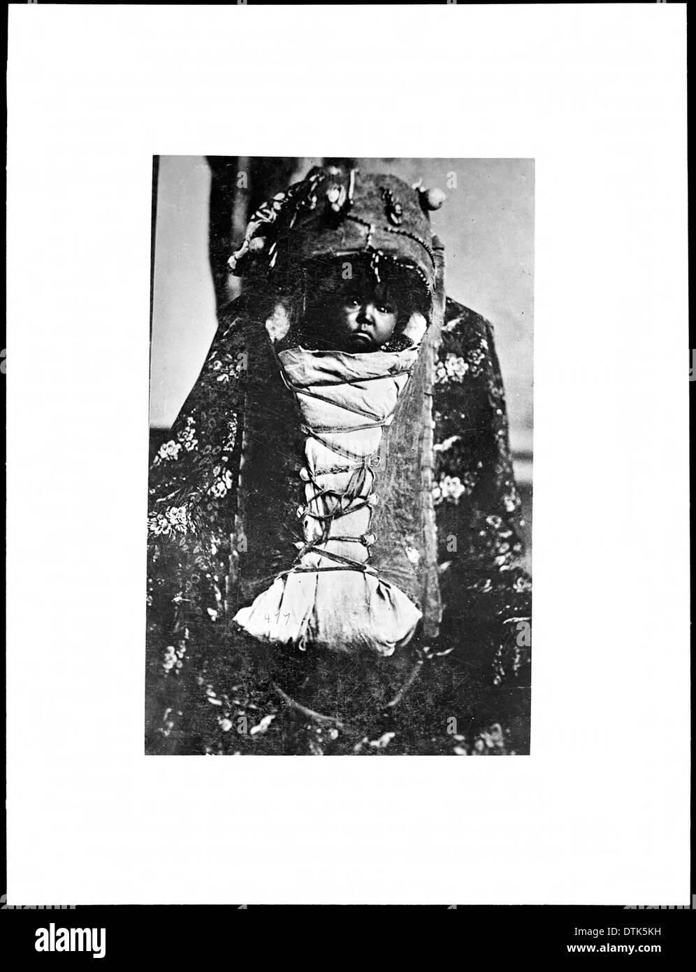 A portrait of an Apache Indian baby, captured around 1900, highlighting ...