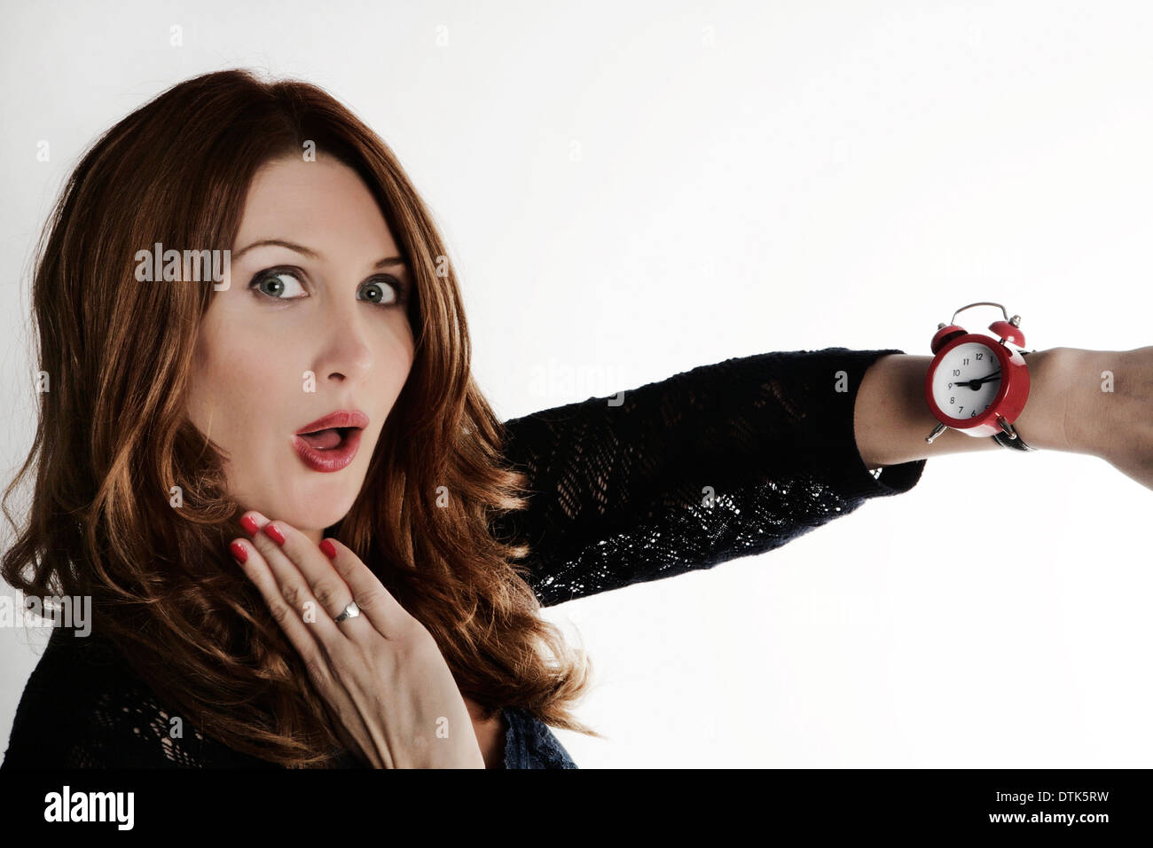 woman looking at watch who running late Stock Photo - Alamy