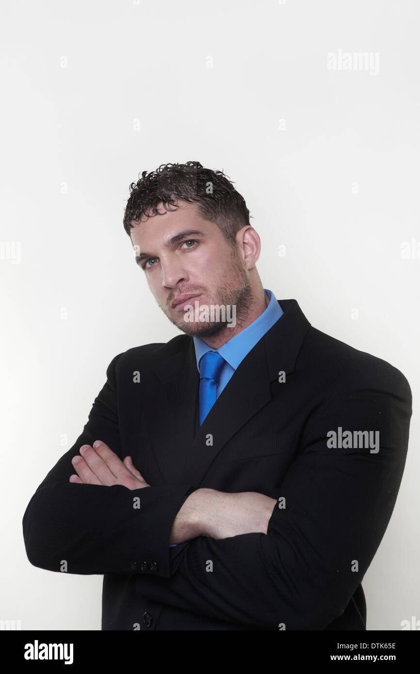 handsome business man standing poses looking around Stock Photo - Alamy