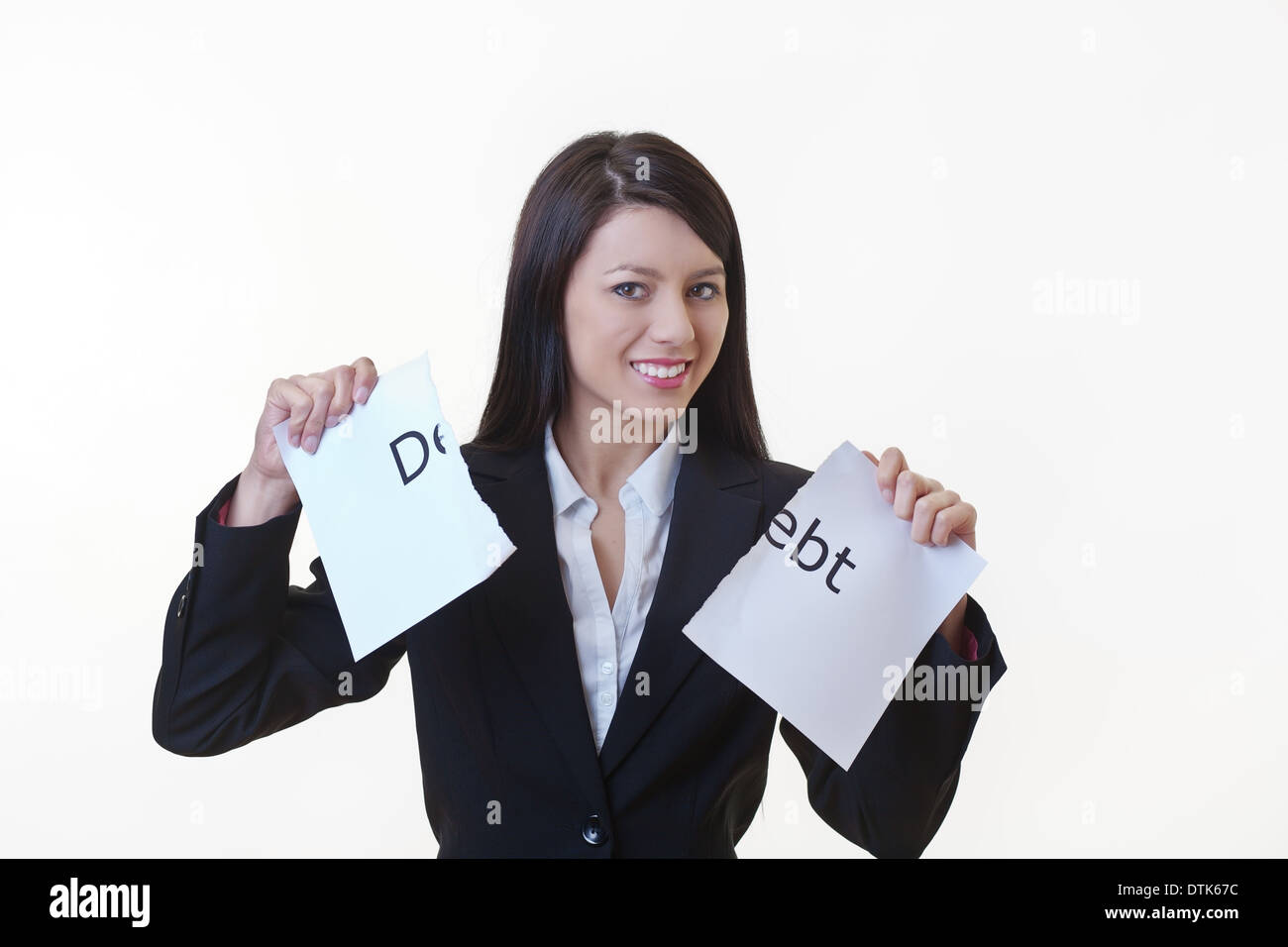 woman holding up a piece of paper with the word debt written on it and ...