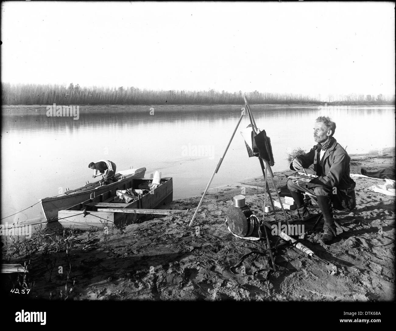 Professor William Judson painting a picture on the bank of the Colorado ...