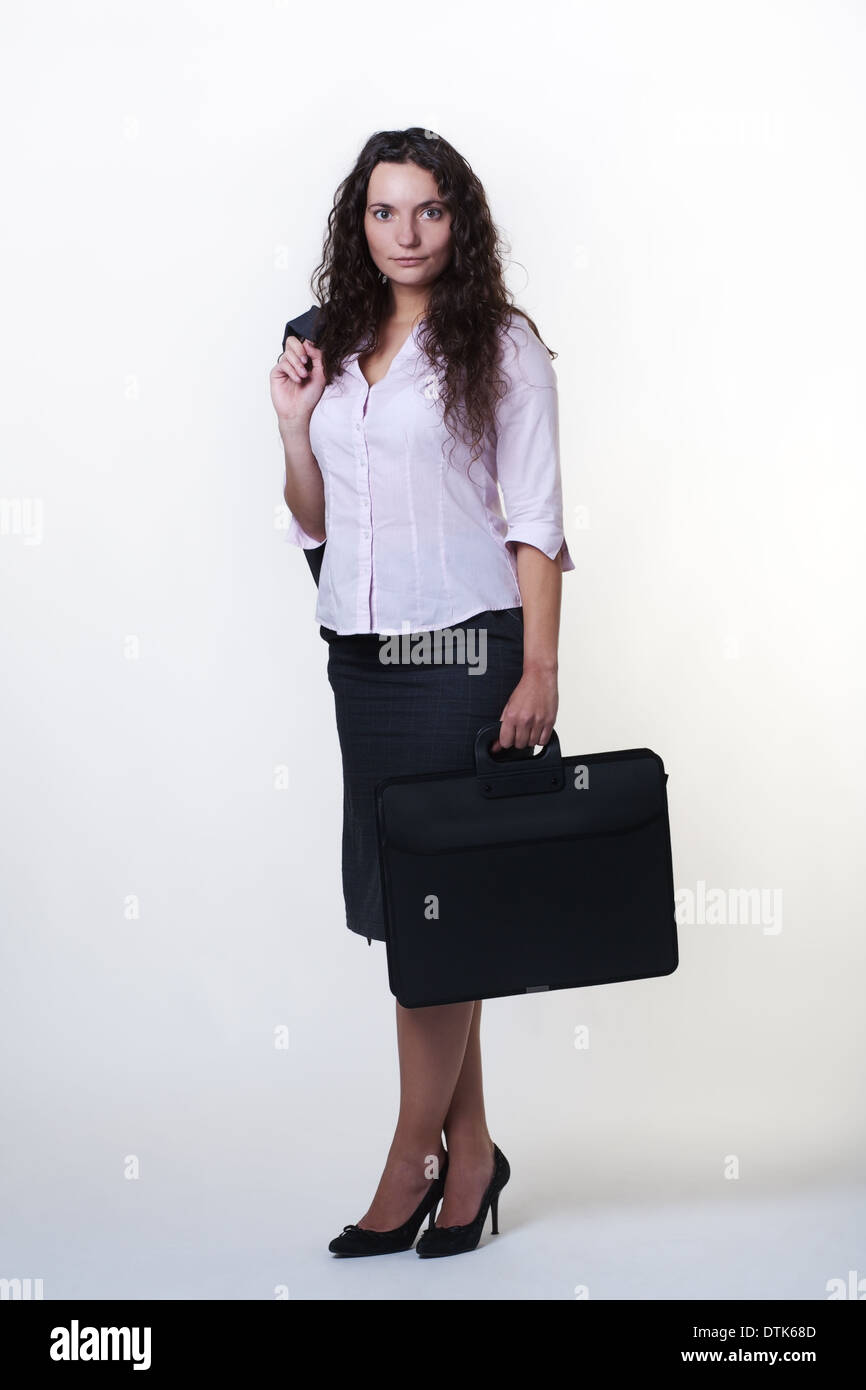 Woman standing with a briefcase hi-res stock photography and images - Alamy