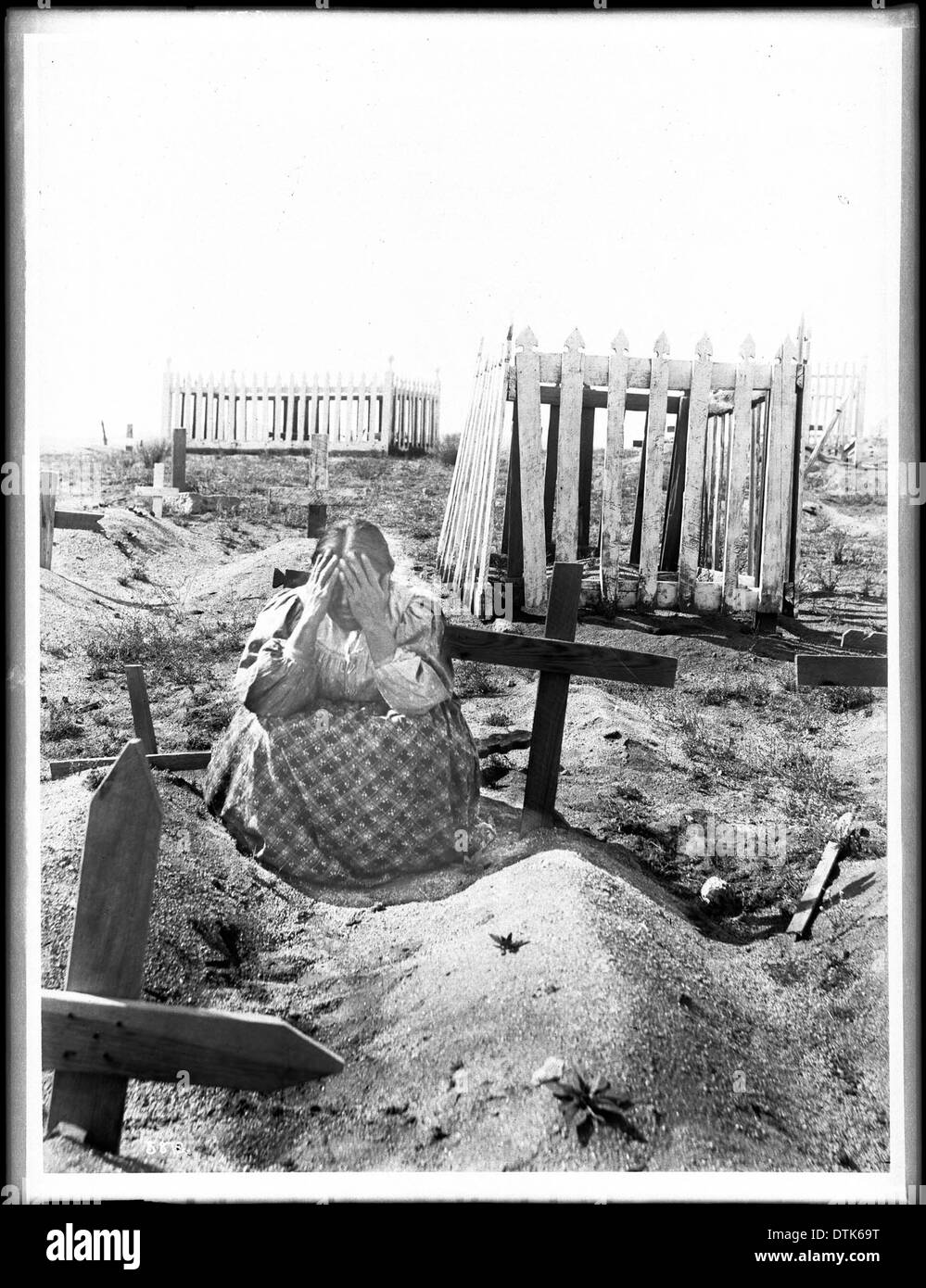 This photograph shows Ramona kneeling at the grave of Alesandro in the ...