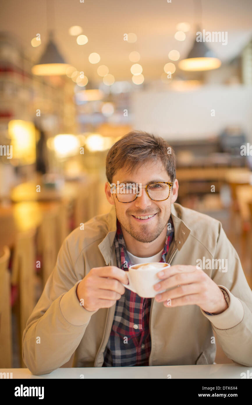 Man drinking coffee in cafe Stock Photo - Alamy
