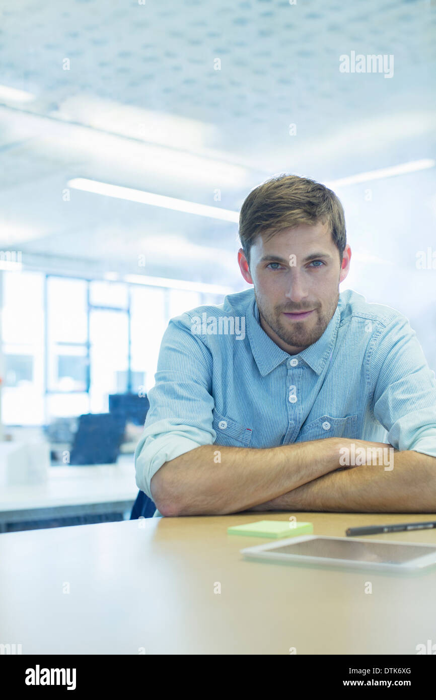 Executive sitting desk arms crossed hi-res stock photography and images ...