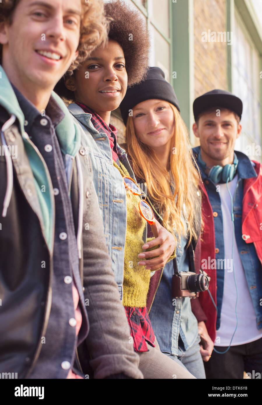 Friends standing together Stock Photo - Alamy