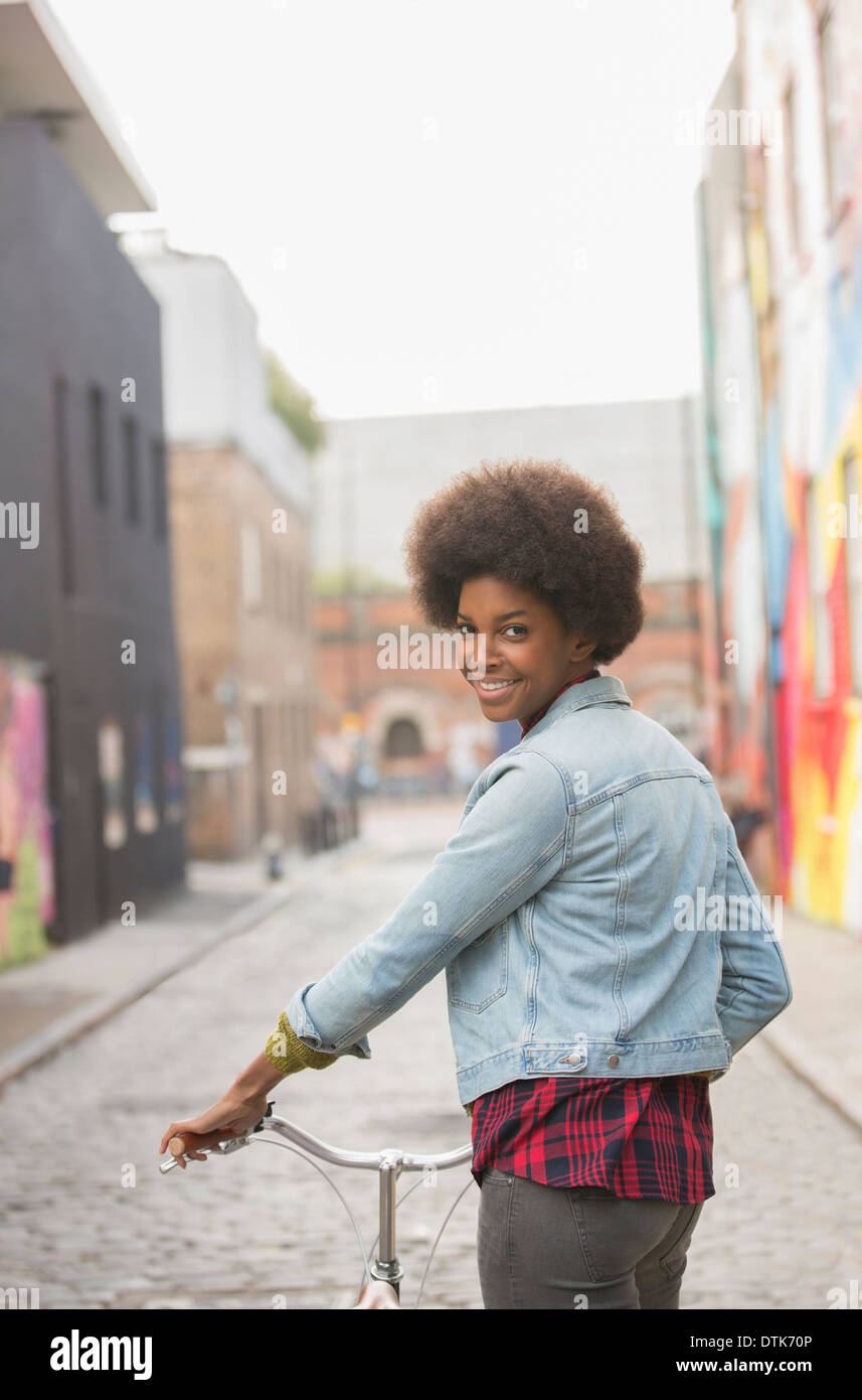 Woman pushing her bicycle hi-res stock photography and images - Alamy