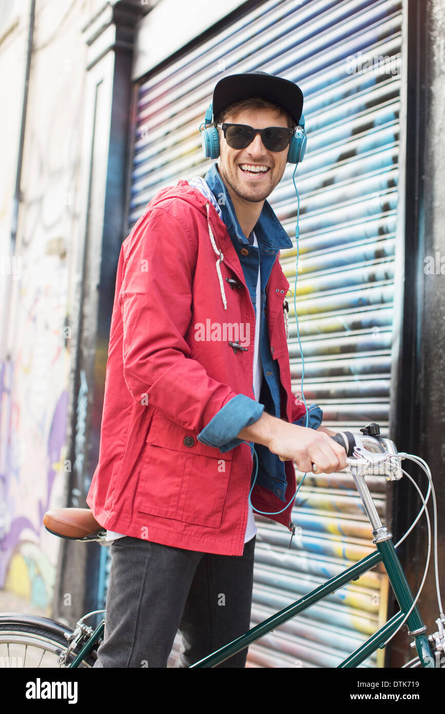 Man pushing his bike hi-res stock photography and images - Alamy