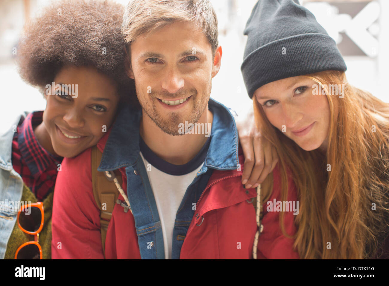 Friends smiling together outdoors Stock Photo - Alamy