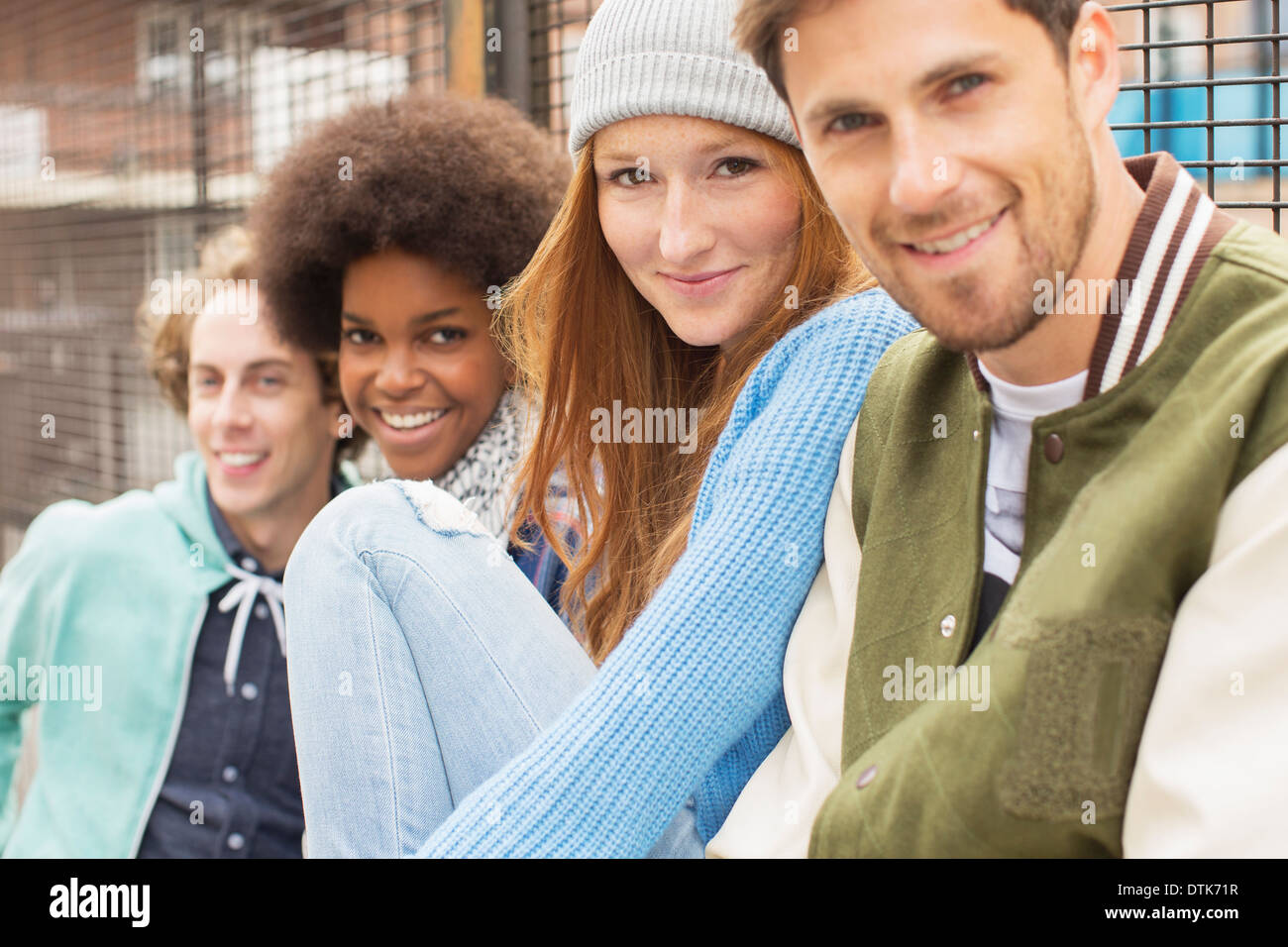 Friends smiling together outdoors Stock Photo - Alamy