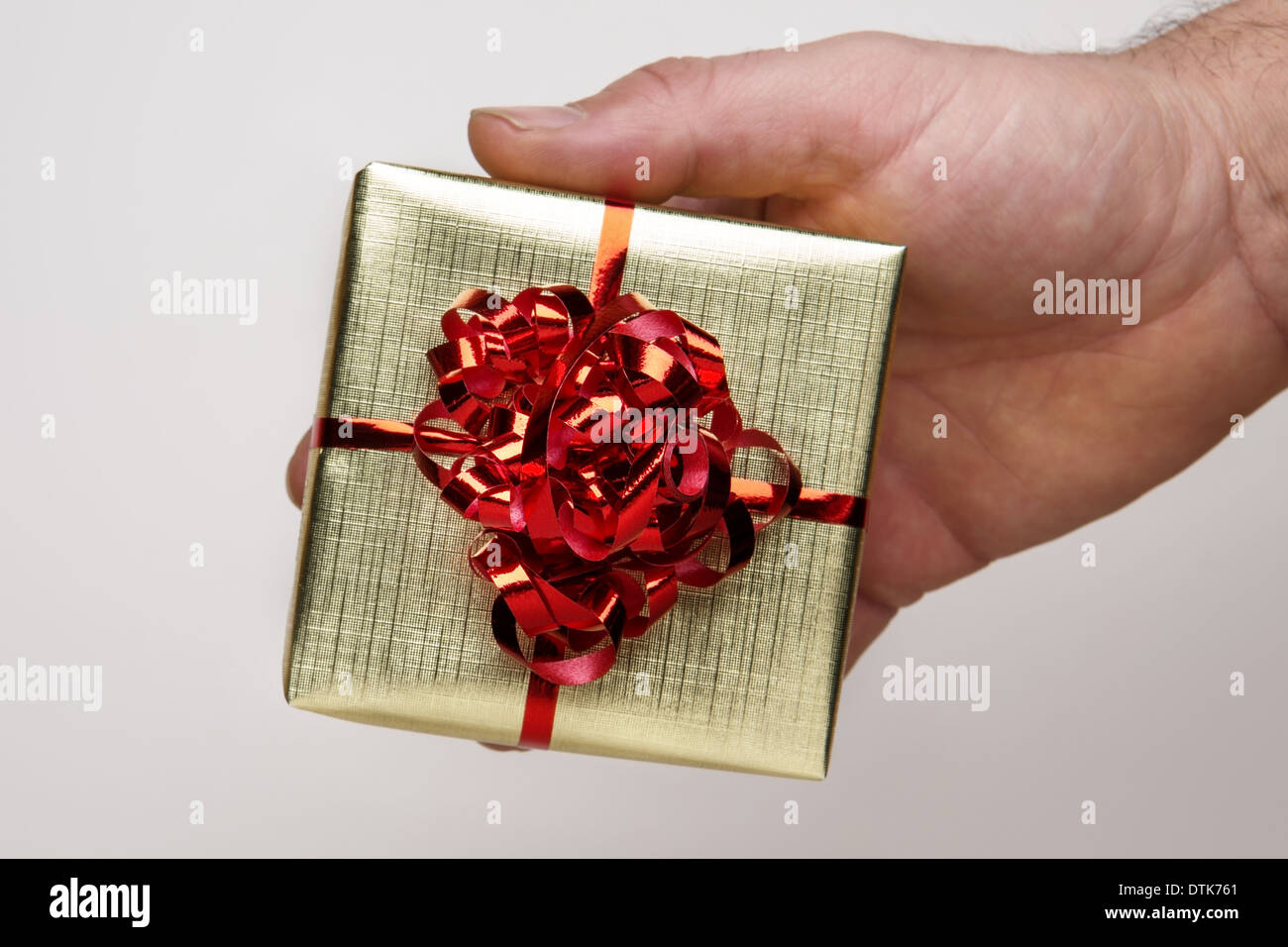 Hand holding tiny package hi-res stock photography and images - Alamy