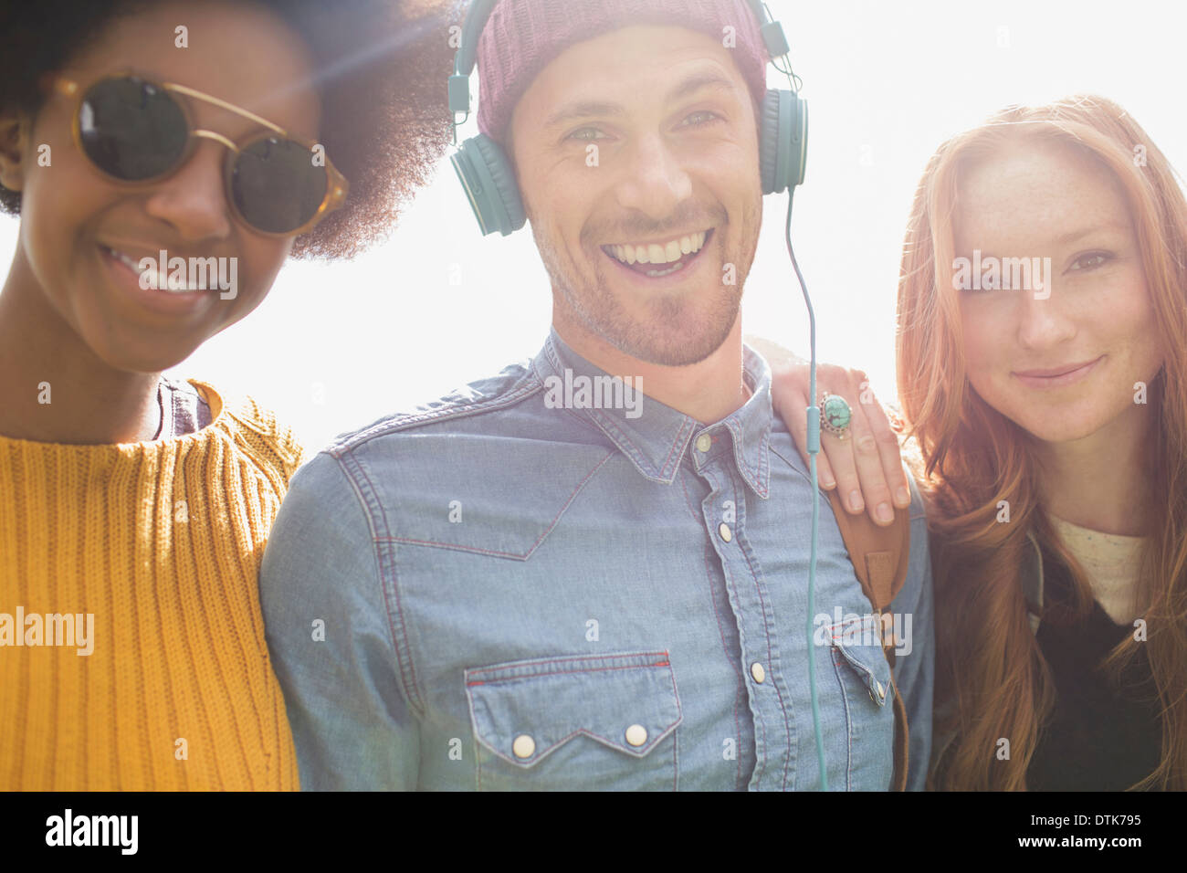 Friends smiling together outdoors Stock Photo - Alamy