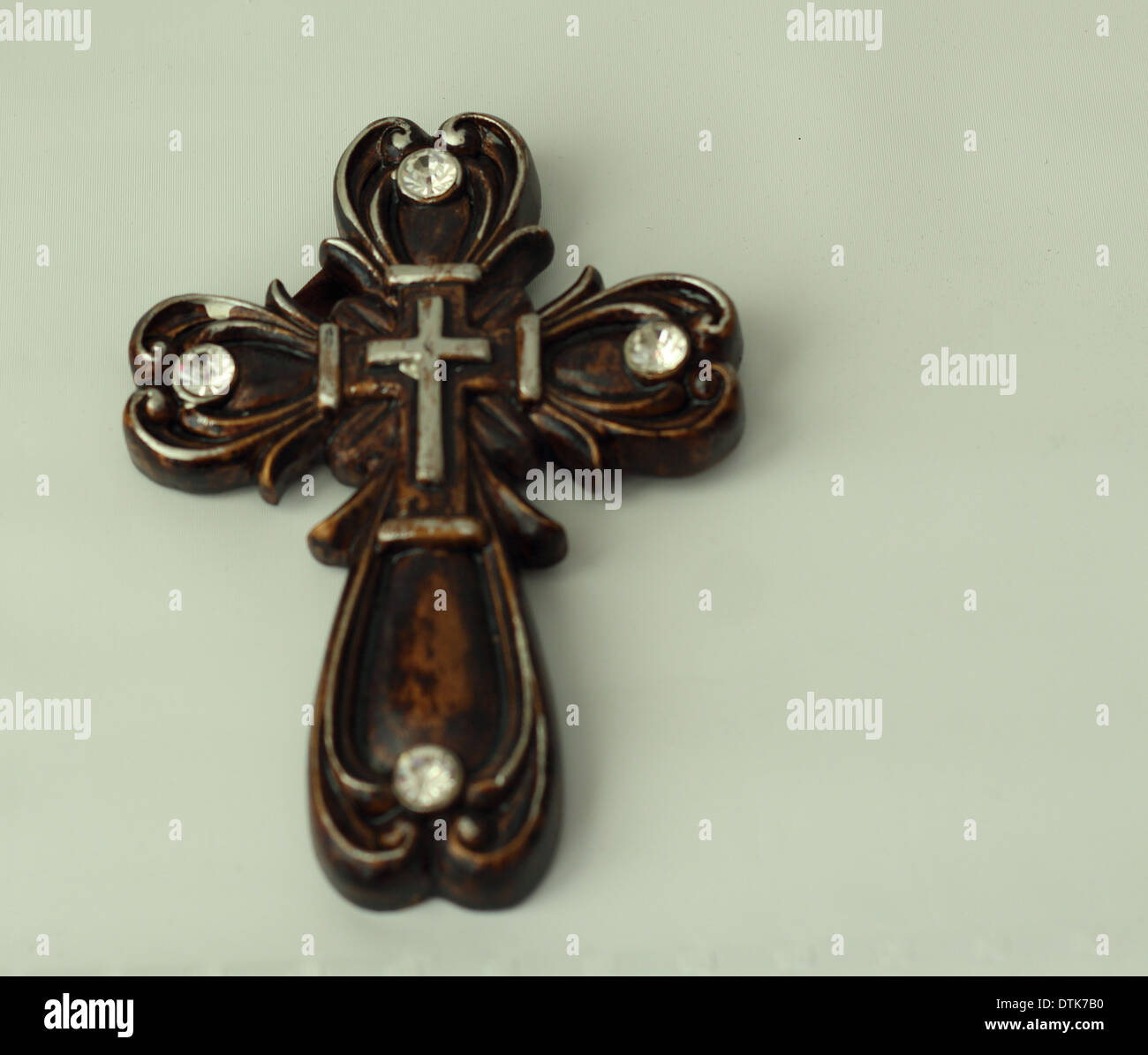 Brown Cross on white background Stock Photo - Alamy