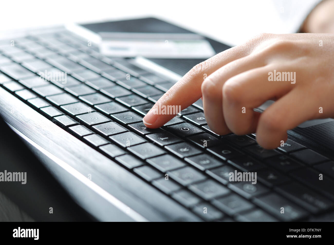 Female hands using laptop and credit card on background Stock Photo - Alamy