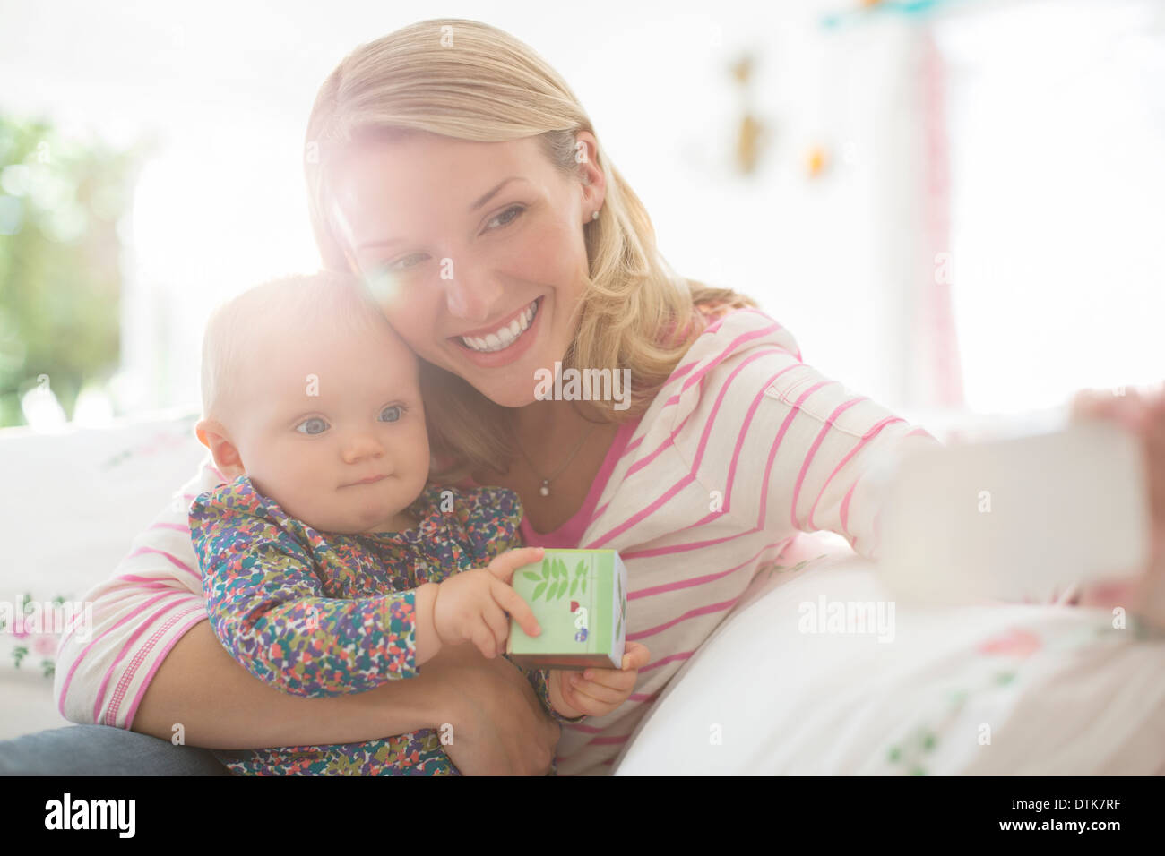 Mother taking self-portrait with baby girl Stock Photo - Alamy