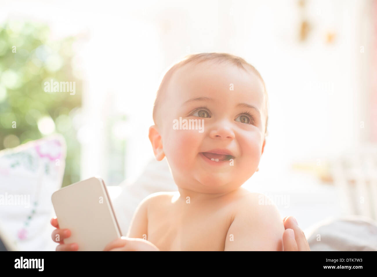 Baby boy playing with cell phone Stock Photo - Alamy