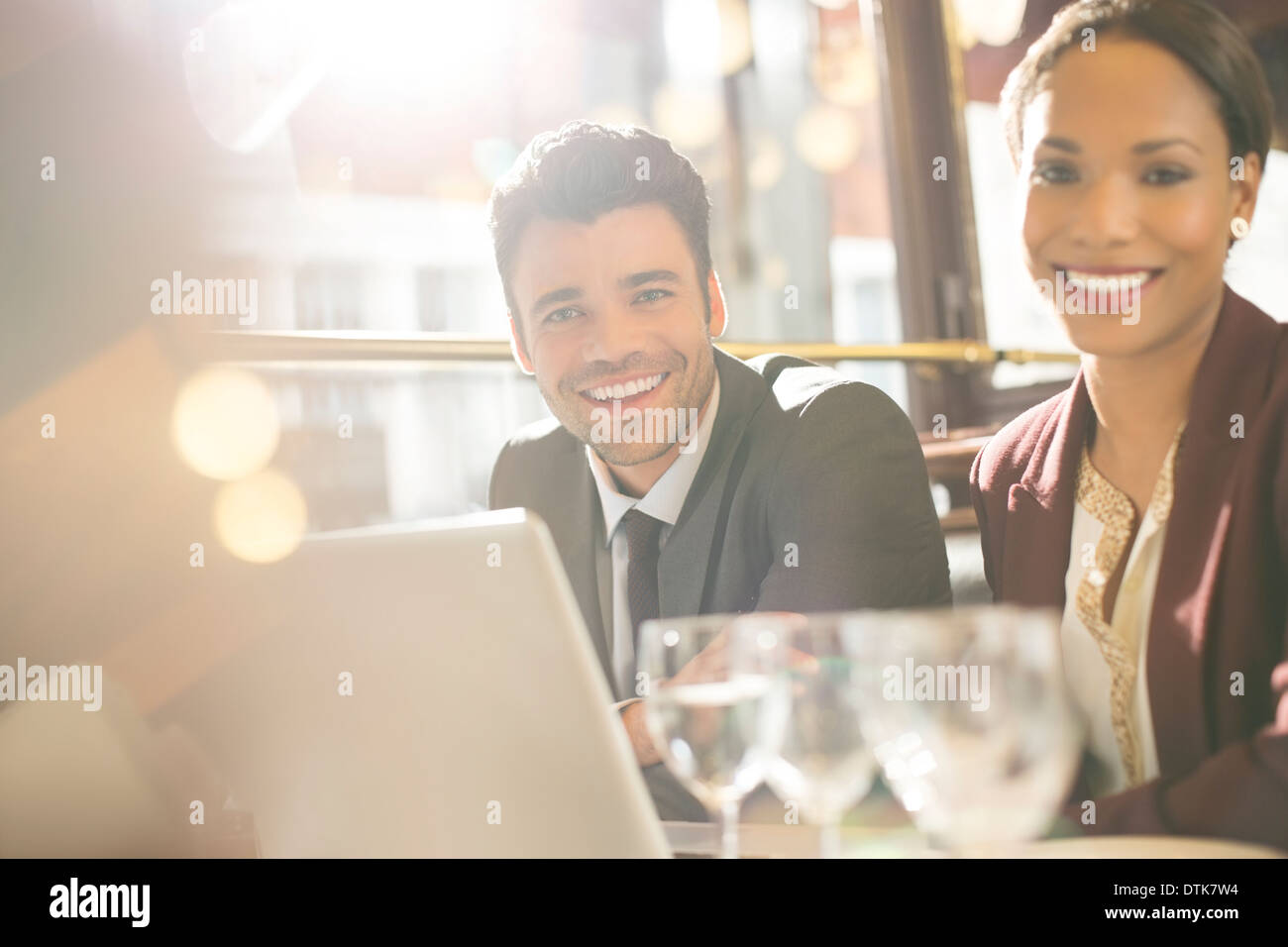 Business people smiling in restaurant Stock Photo - Alamy