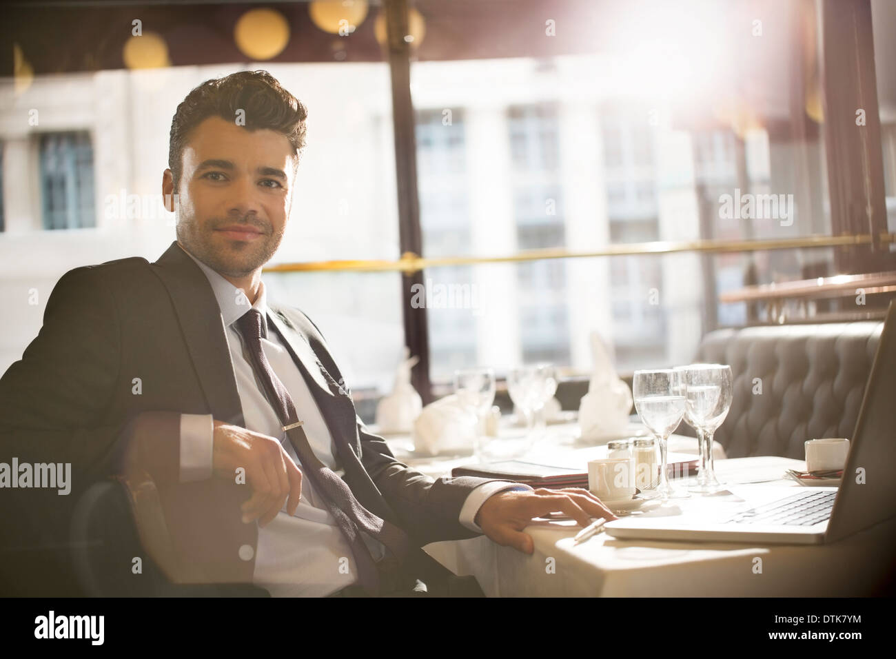Businessman smiling in restaurant Stock Photo - Alamy
