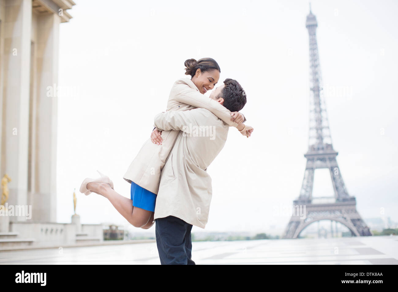 Couple hugging near Eiffel Tower, Paris, France Stock Photo - Alamy
