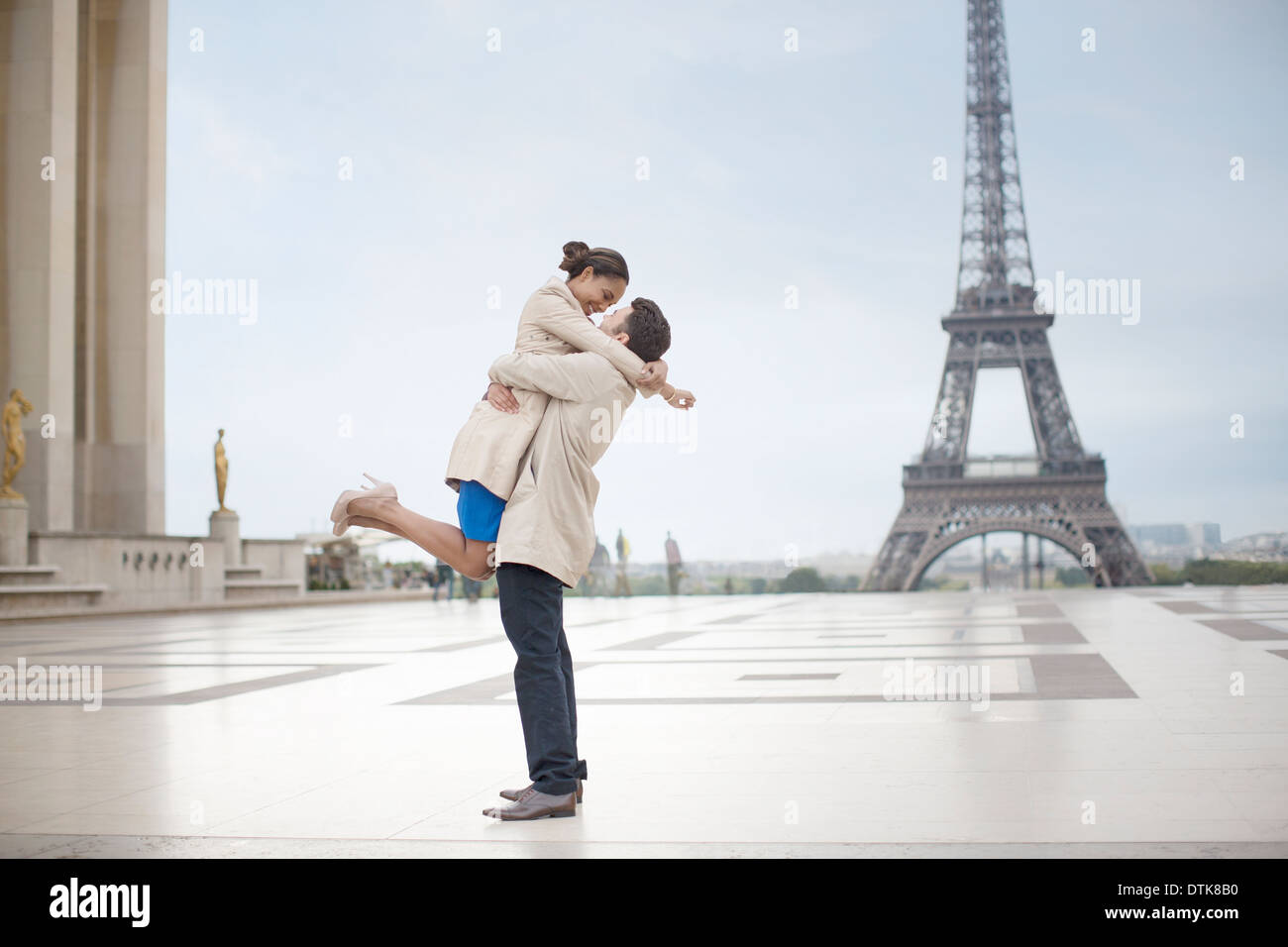 Couple hugging near Eiffel Tower, Paris, France Stock Photo - Alamy