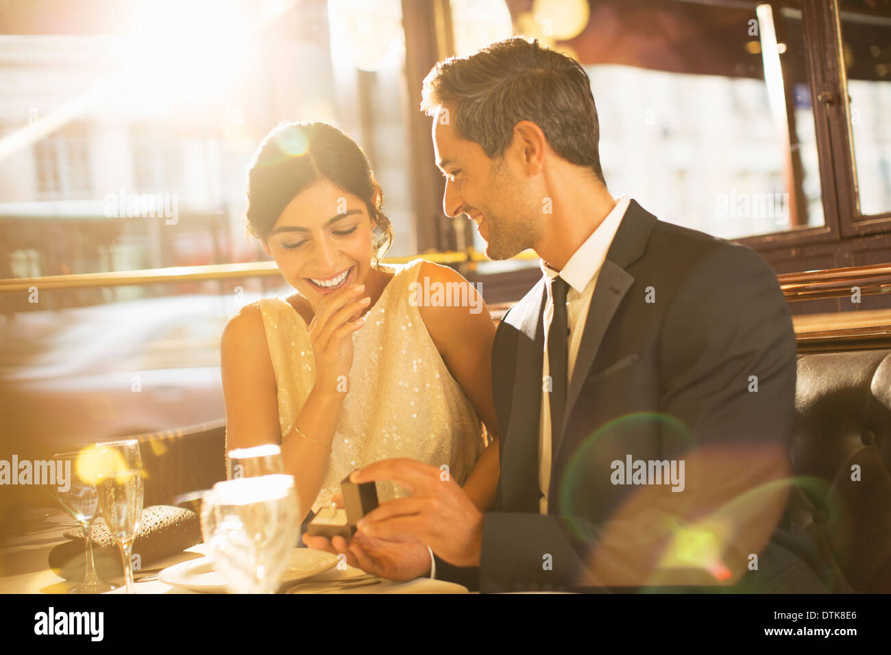 Man proposing to girlfriend in restaurant Stock Photo - Alamy