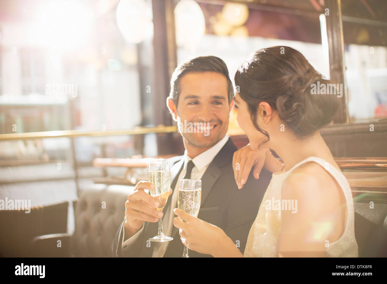 Couple drinking champagne in restaurant Stock Photo - Alamy