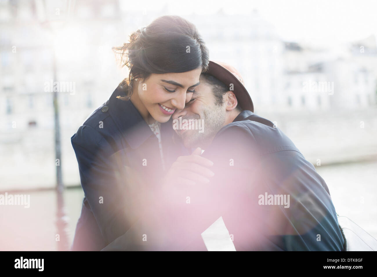 Couple hugging along Seine River, Paris, France Stock Photo - Alamy