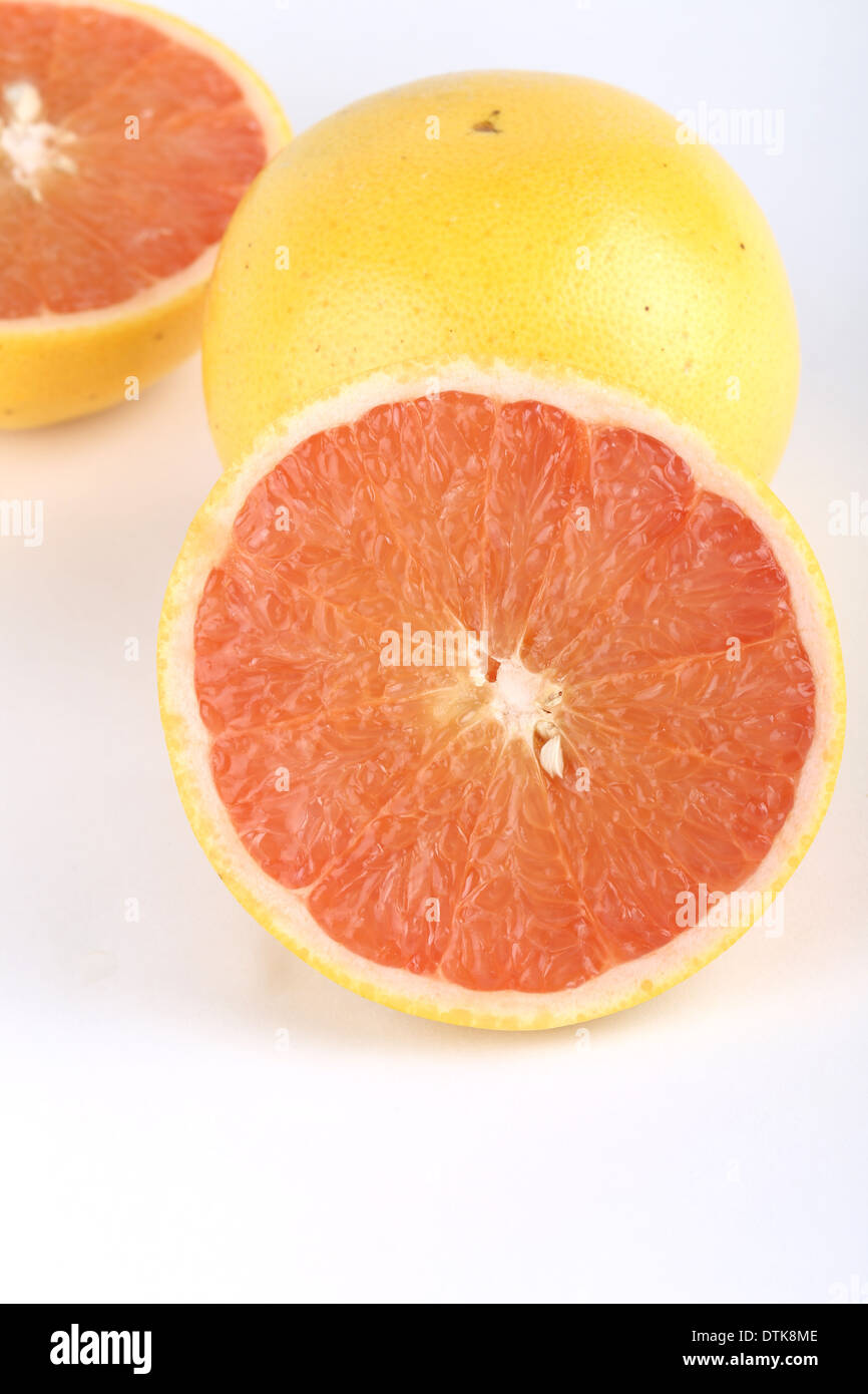 Ripe grapefruit on a white background Stock Photo - Alamy