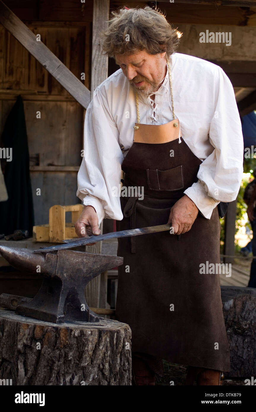 A blacksmith working at the Minnesota Renaissance Festival Stock Photo ...