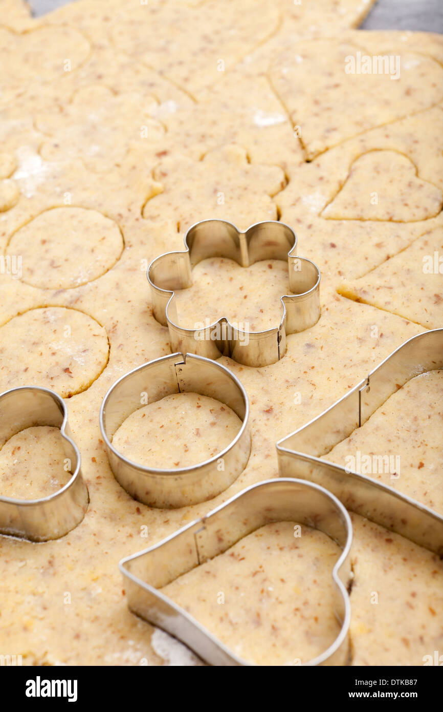 Cookie cutter in different shapes lie on cookie dough with Copy Space ...