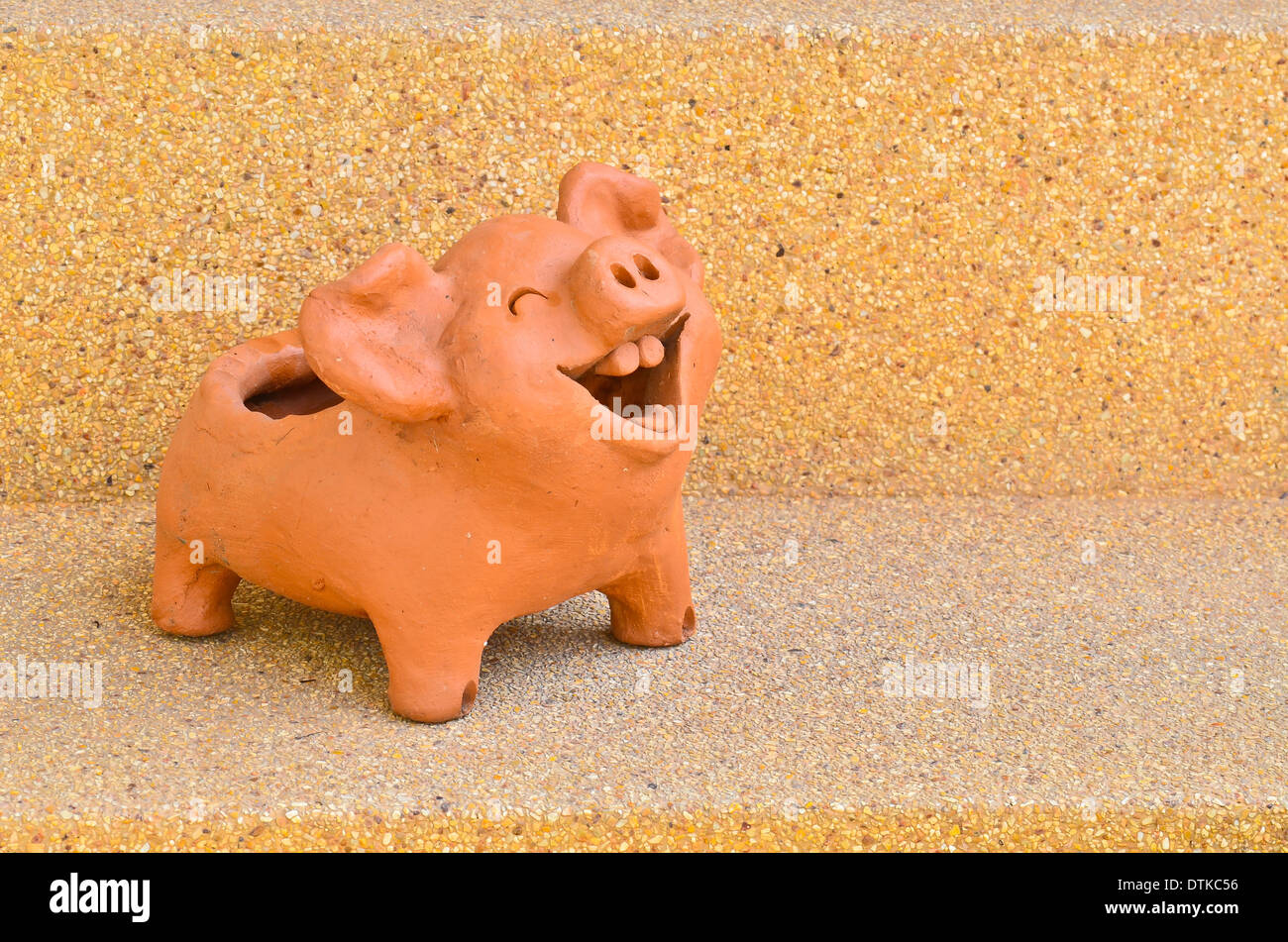 Laughing pig statue Stock Photo - Alamy