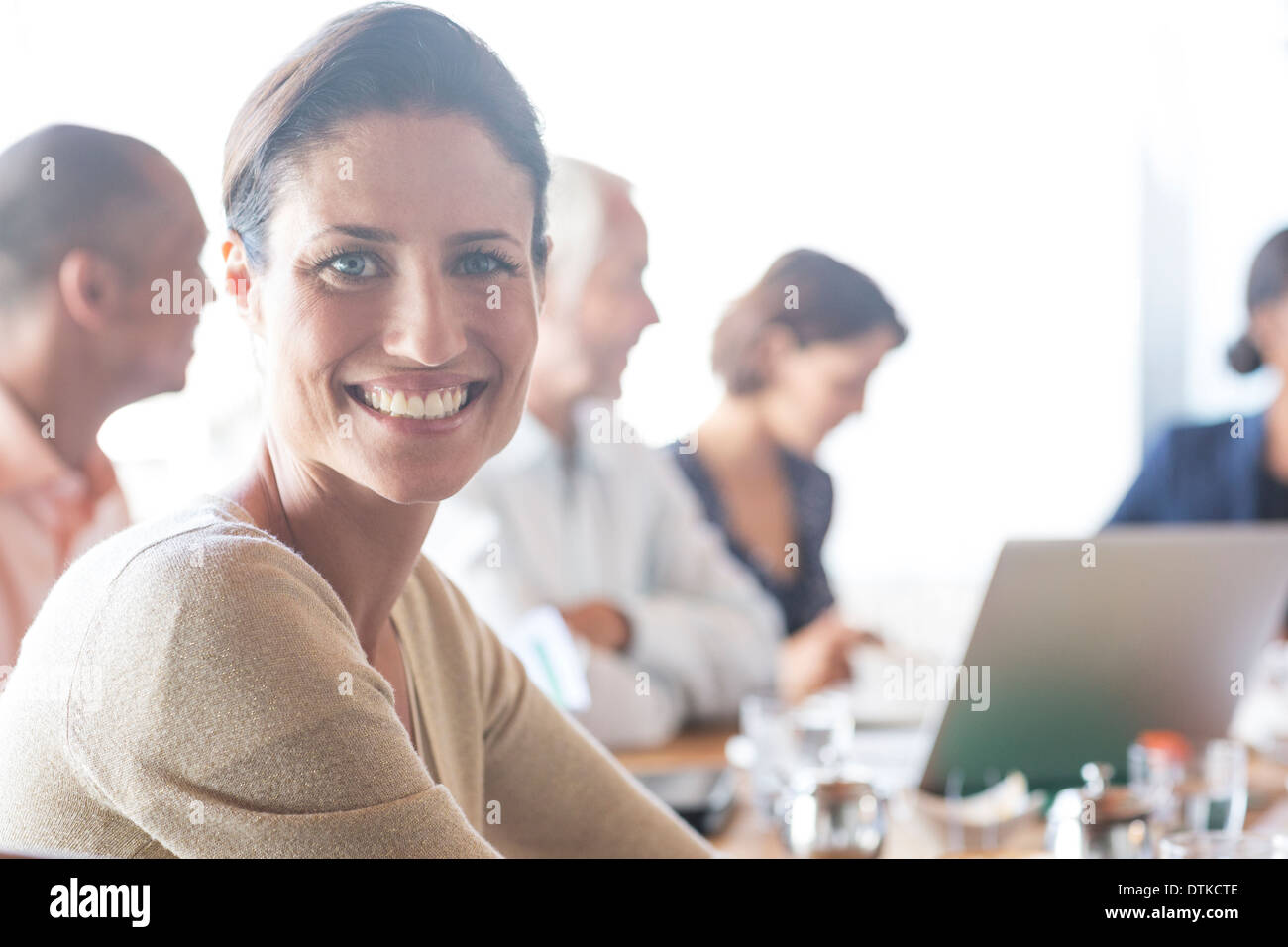 Five businesspeople in boardroom smiling hi-res stock photography and ...