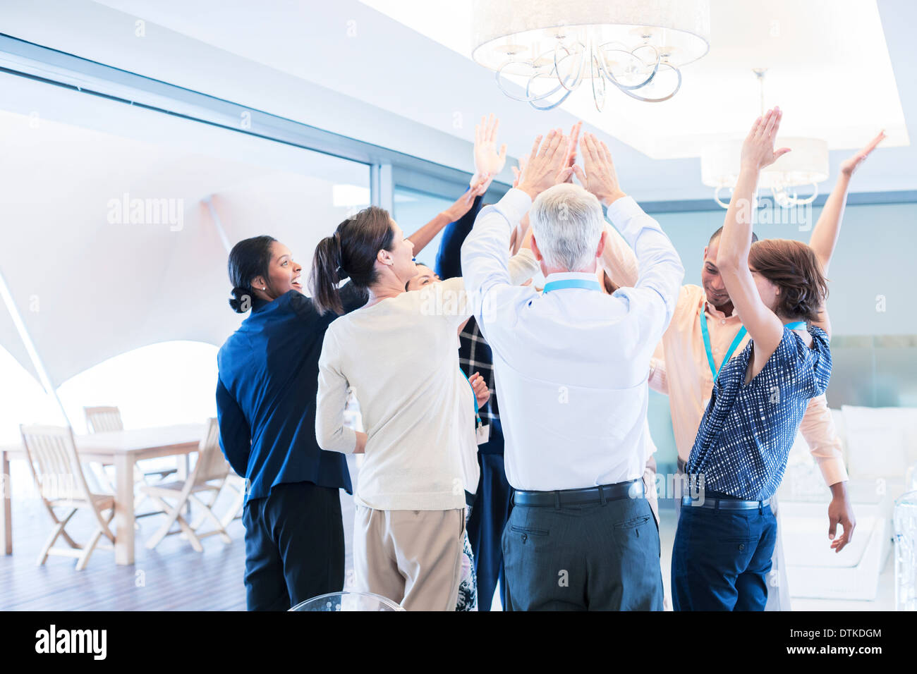 Business people cheering in office Stock Photo - Alamy