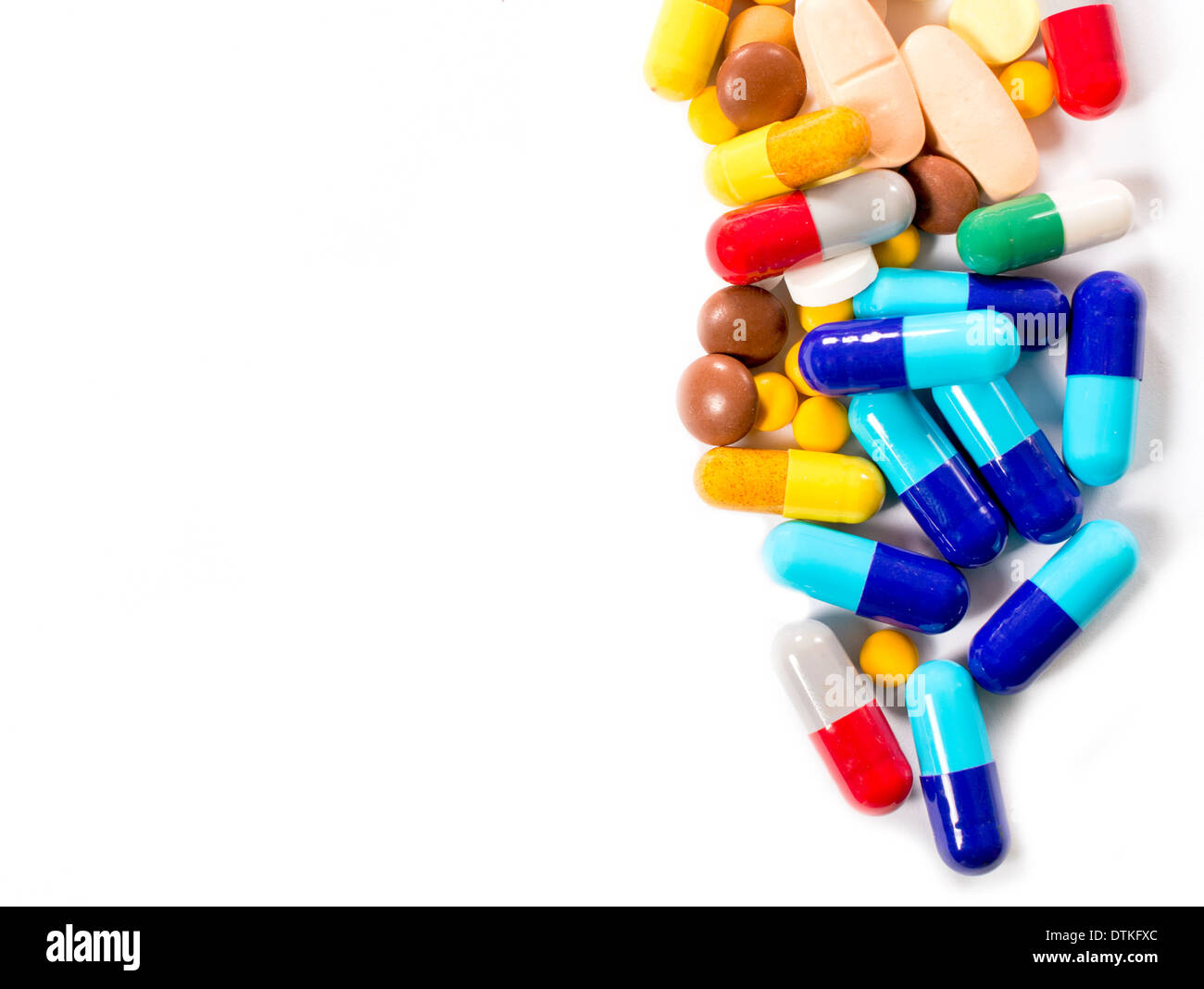 Bunch of pills on white background with blank space for text on left ...