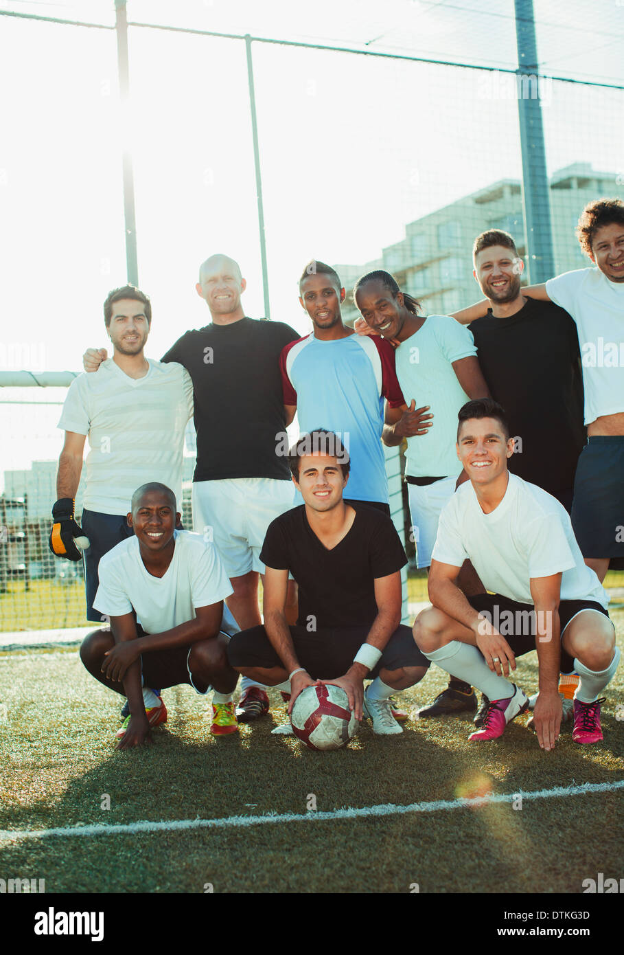 Soccer players smiling on field Stock Photo - Alamy