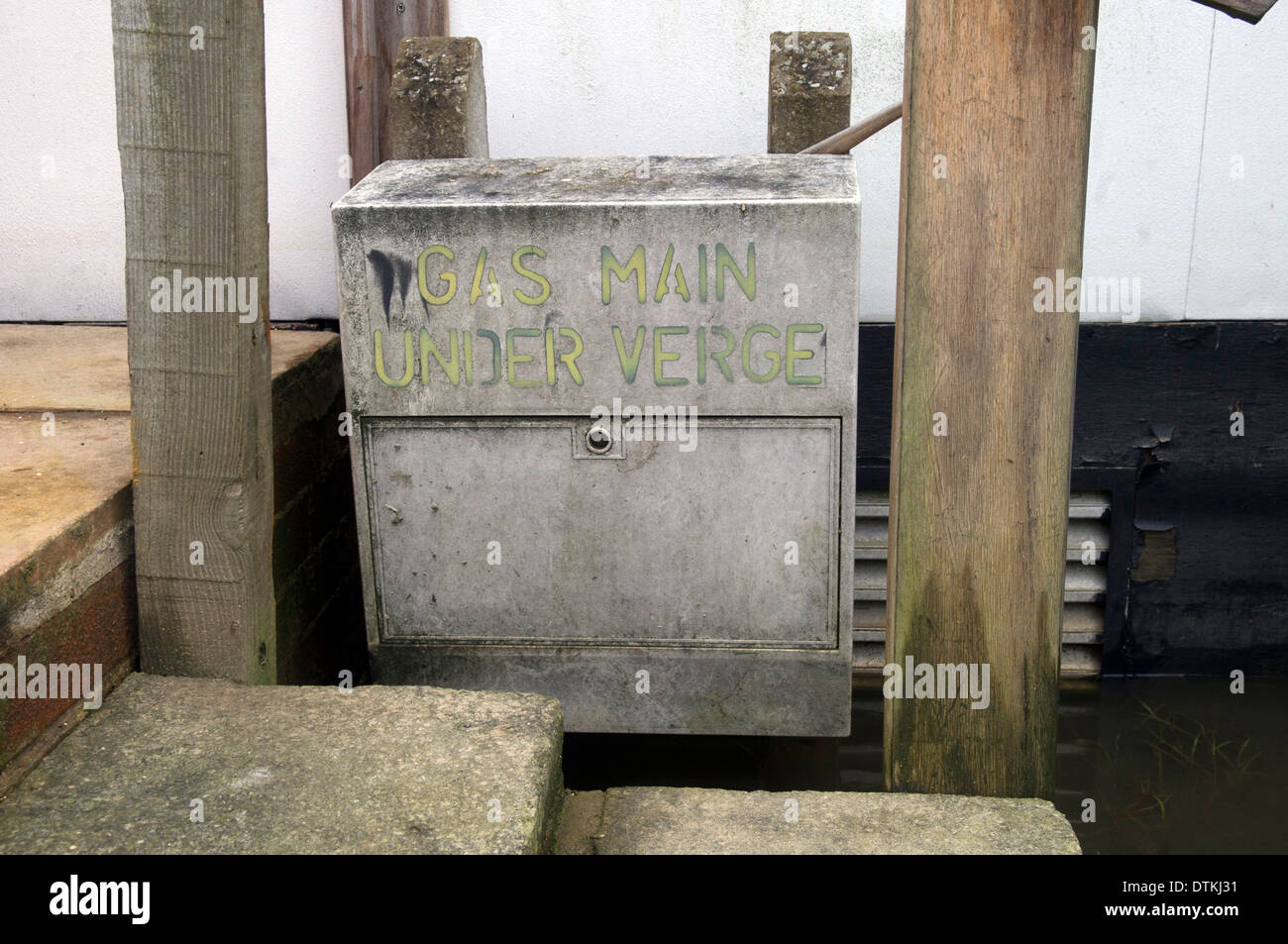 Prefabricated housing flooded along the Thames. Dirty old electric ...