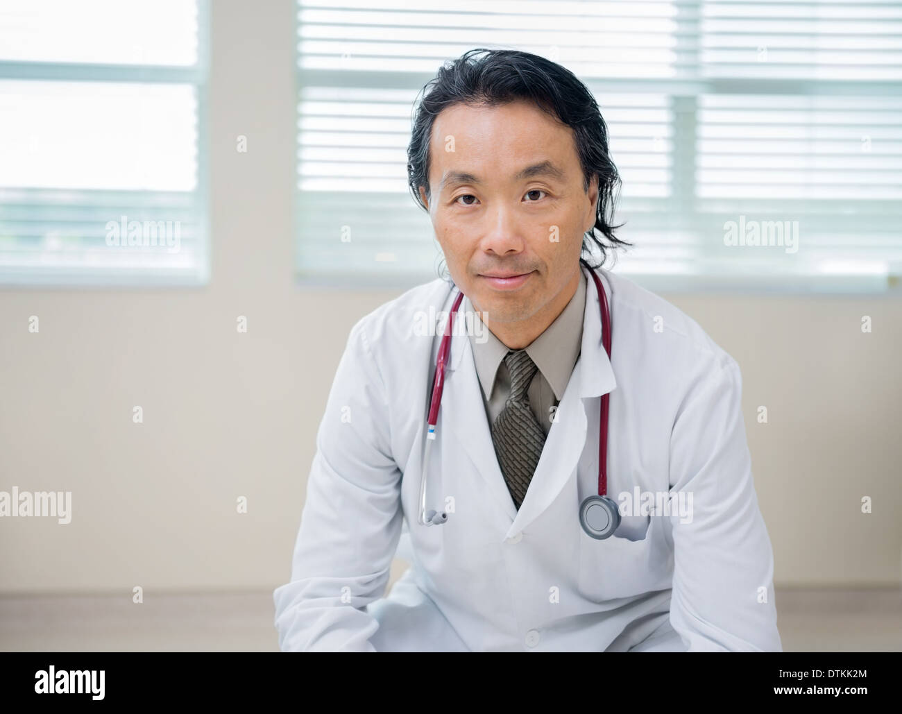 Doctor sitting in hospital hi-res stock photography and images - Alamy