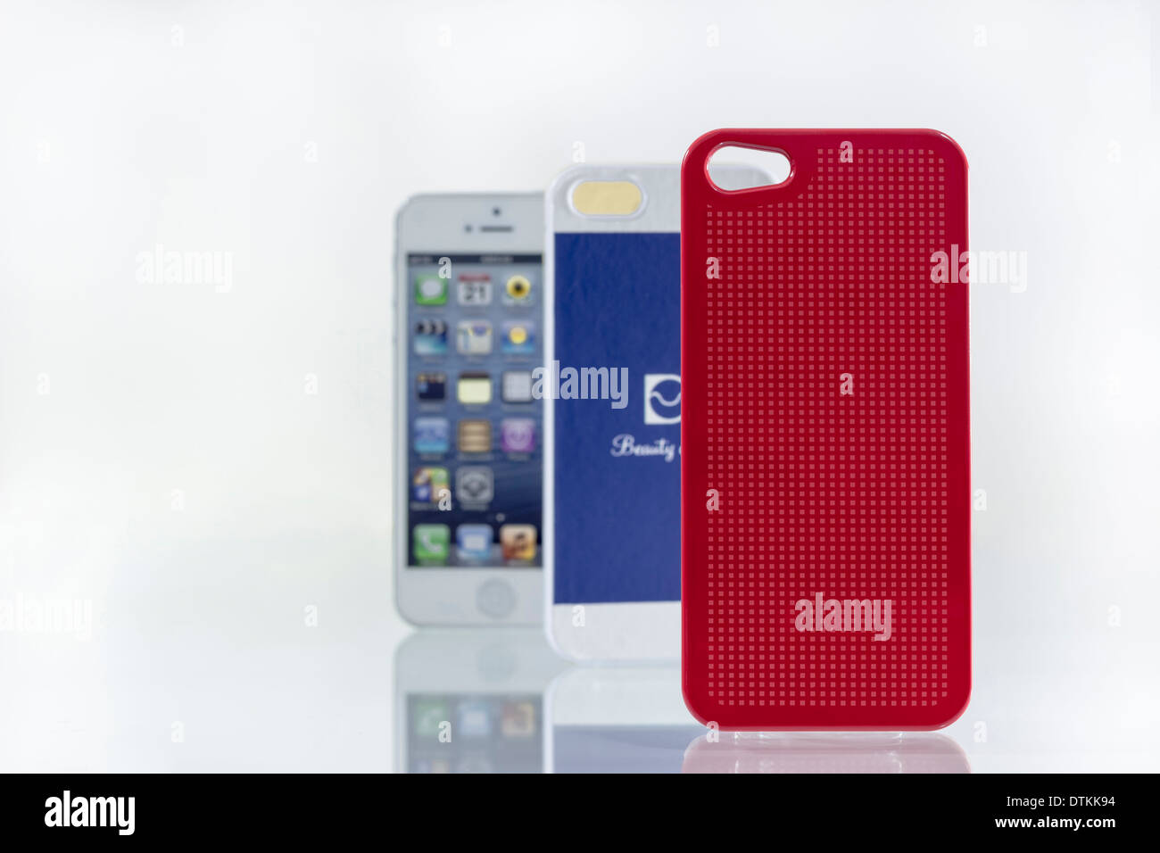 stylish mobile phone and its bright blue and red covers Stock Photo - Alamy
