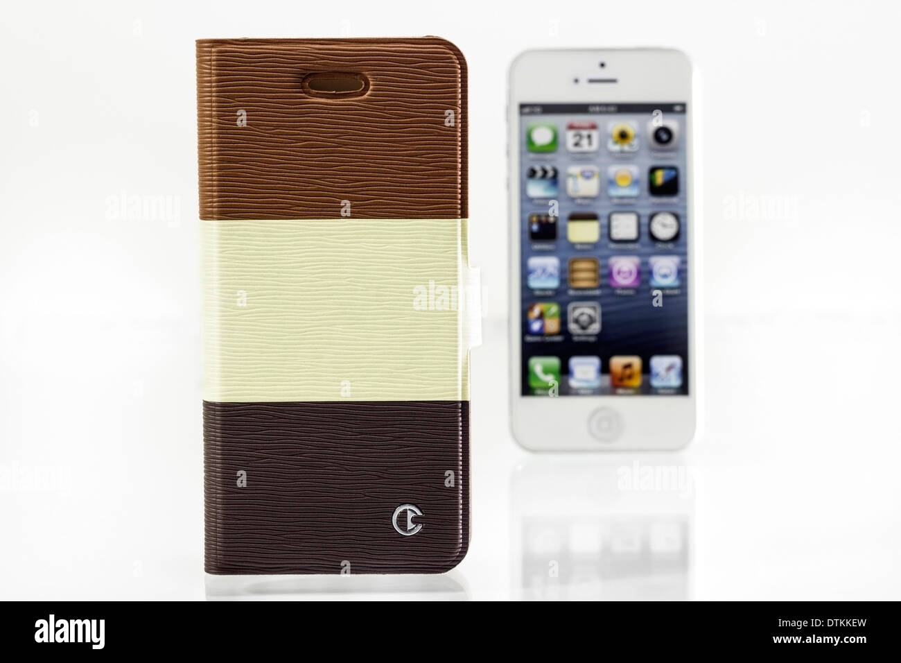 cell phone and their stylish brown cover Stock Photo - Alamy