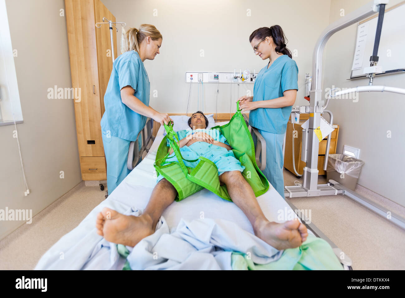Nurses Preparing Male Patient Before Transferring Him On Hydraul Stock ...