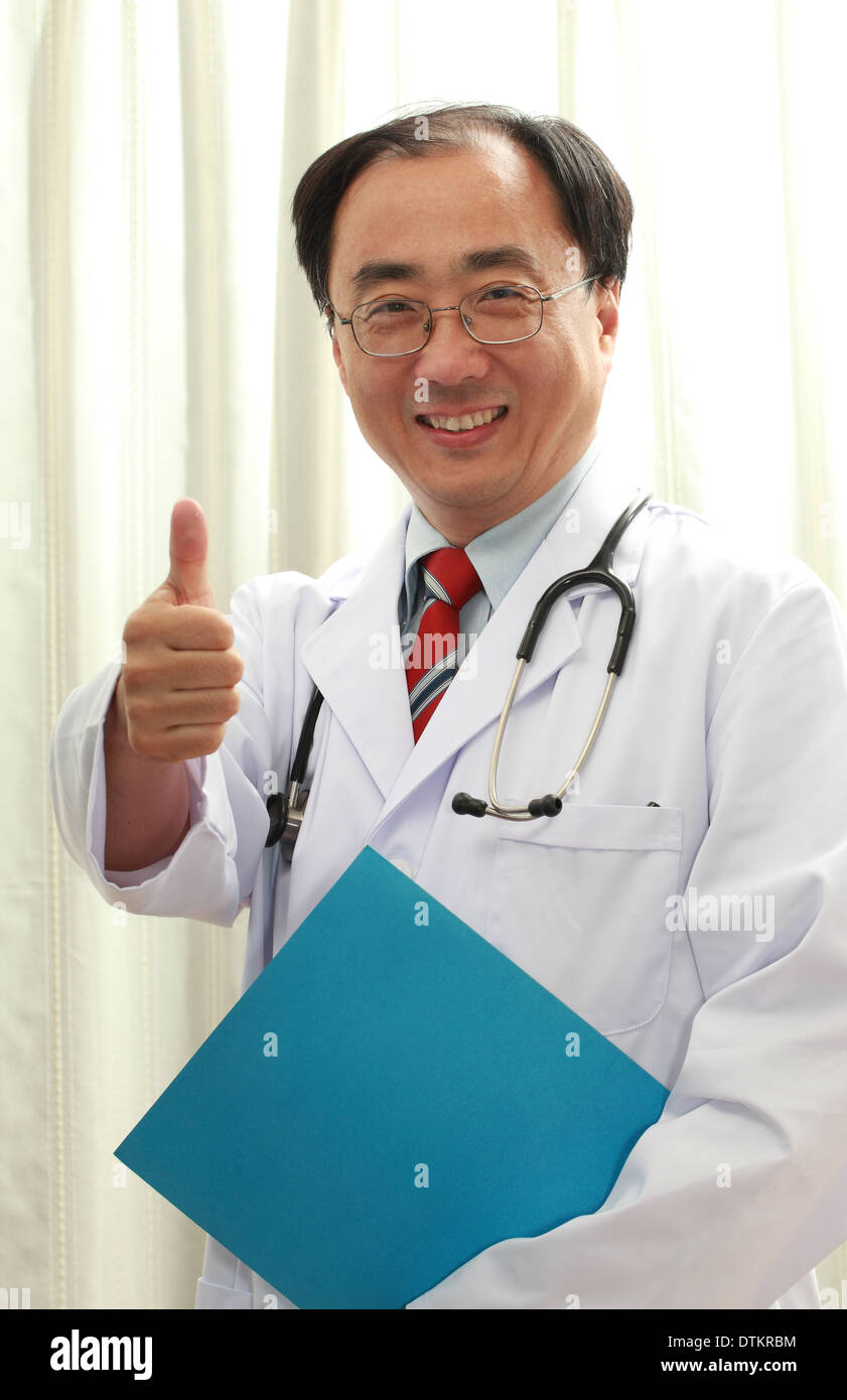 Asian male doctor smiling at the camera in uniform Stock Photo - Alamy