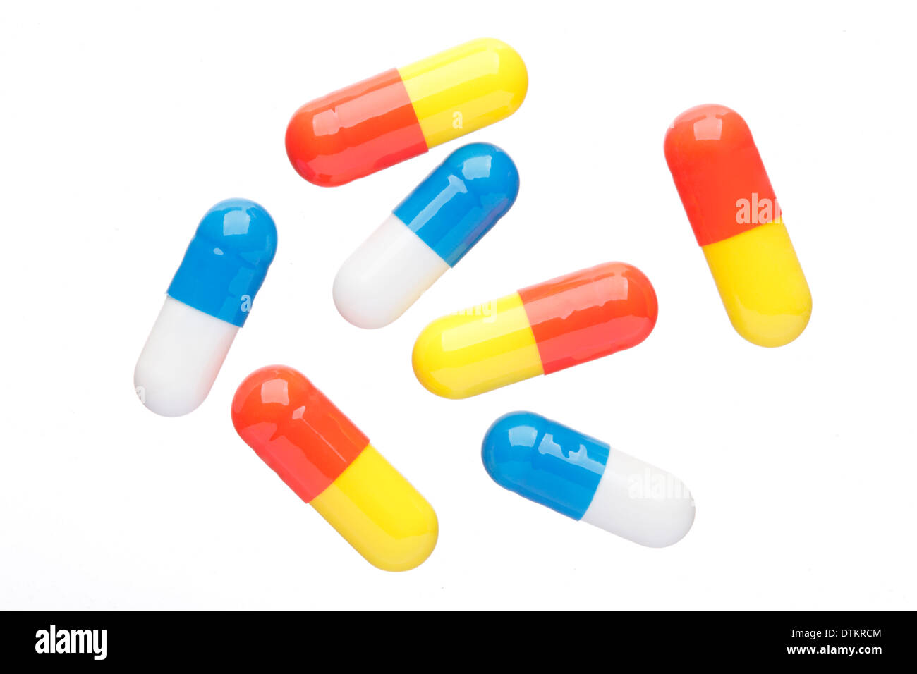 Colorful medical capsules isolated on white Stock Photo - Alamy