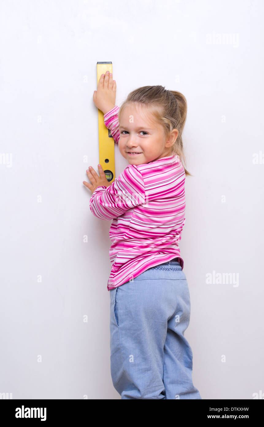 Little girl with measuring level Stock Photo - Alamy