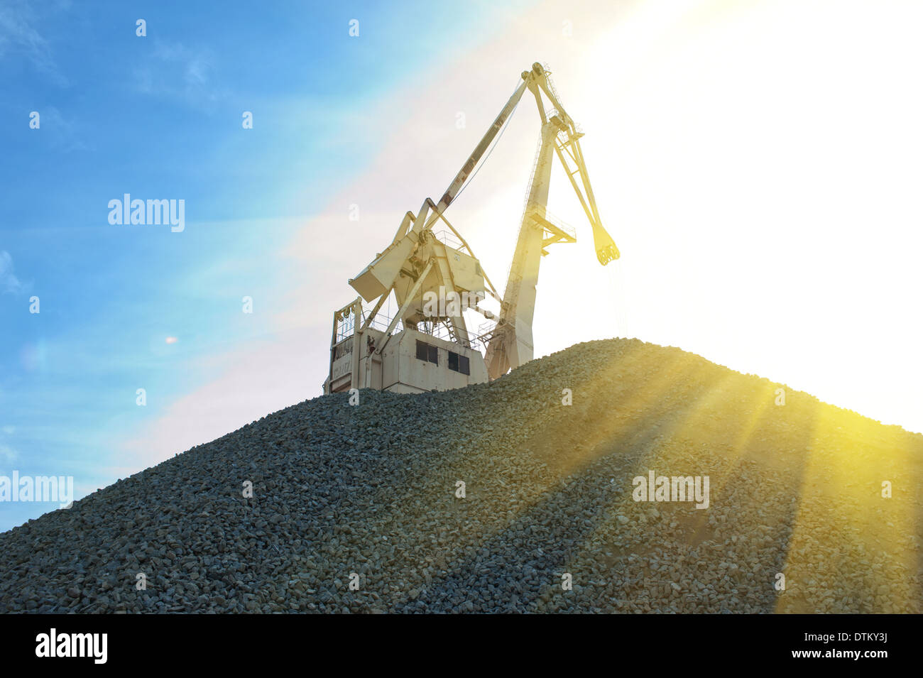 crane at heap of gravel Stock Photo - Alamy