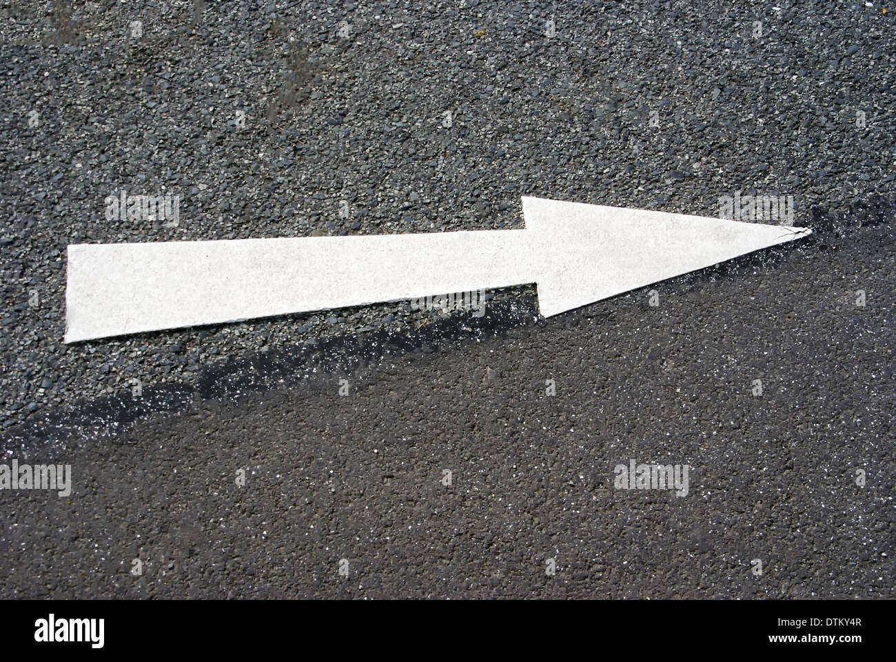 White directional arrow on road hi-res stock photography and images - Alamy