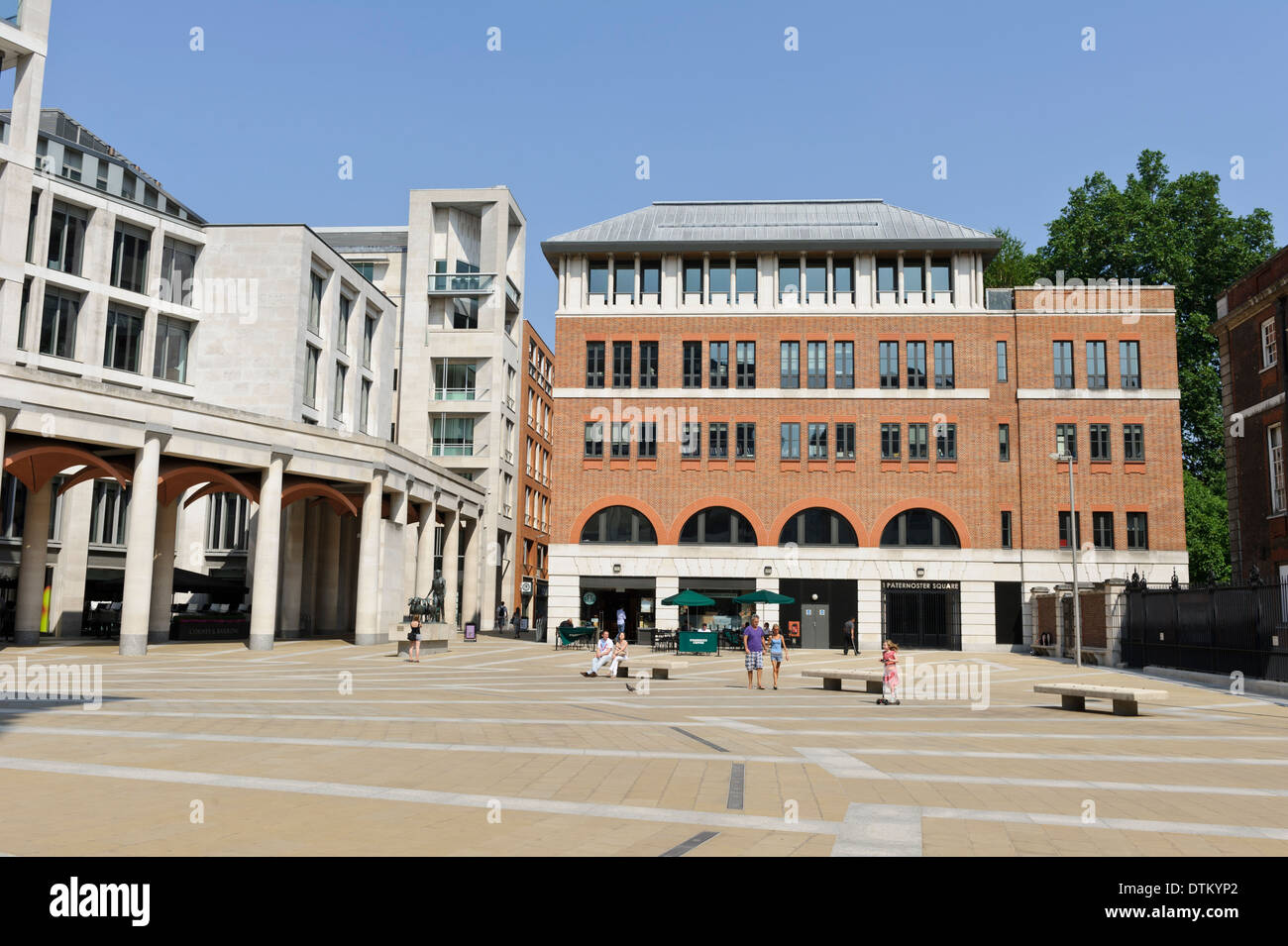 Visitors in Paternoster Square which has bars, restaurant and a ...